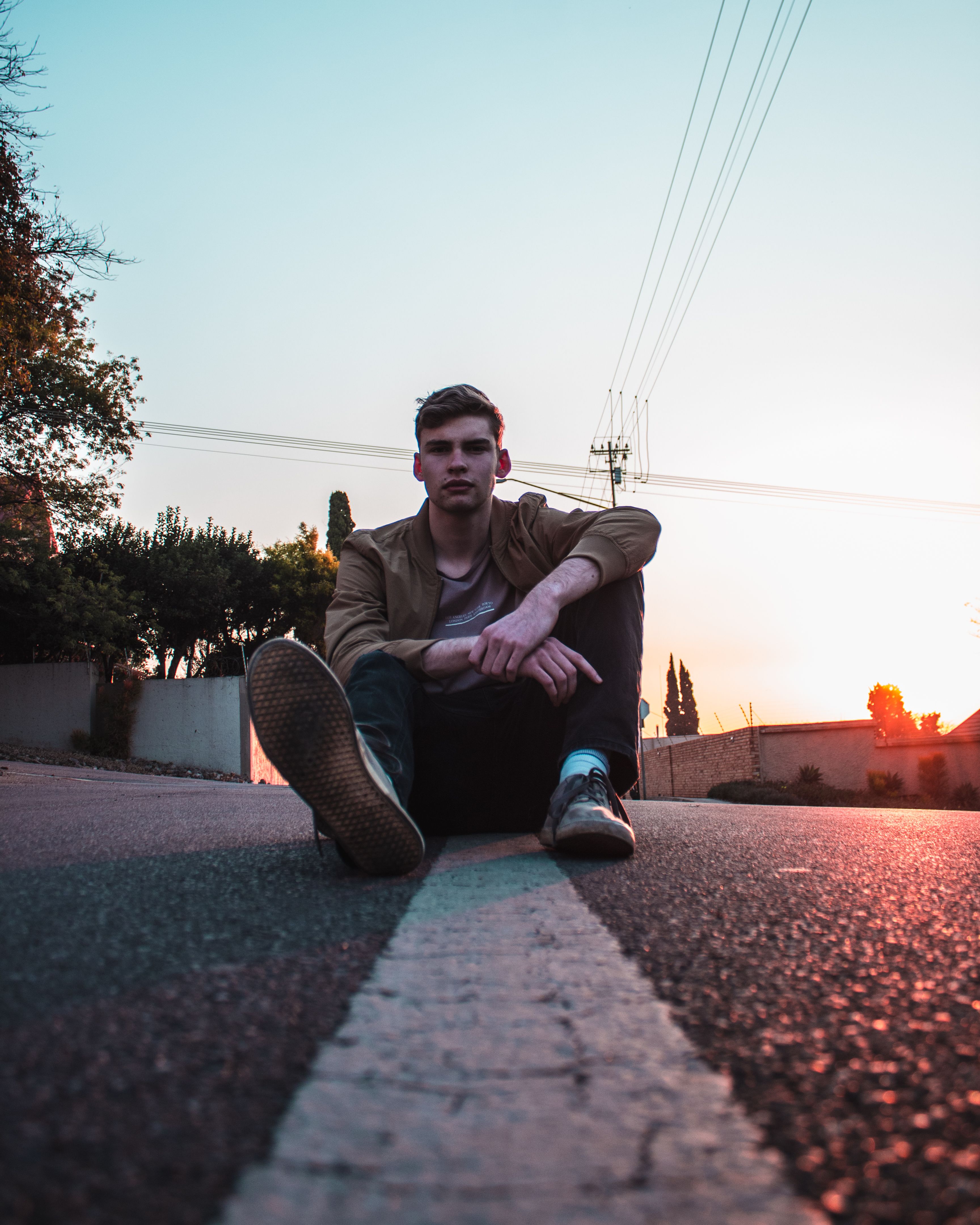 A Woman Sitting on the Road · Free Stock Photo