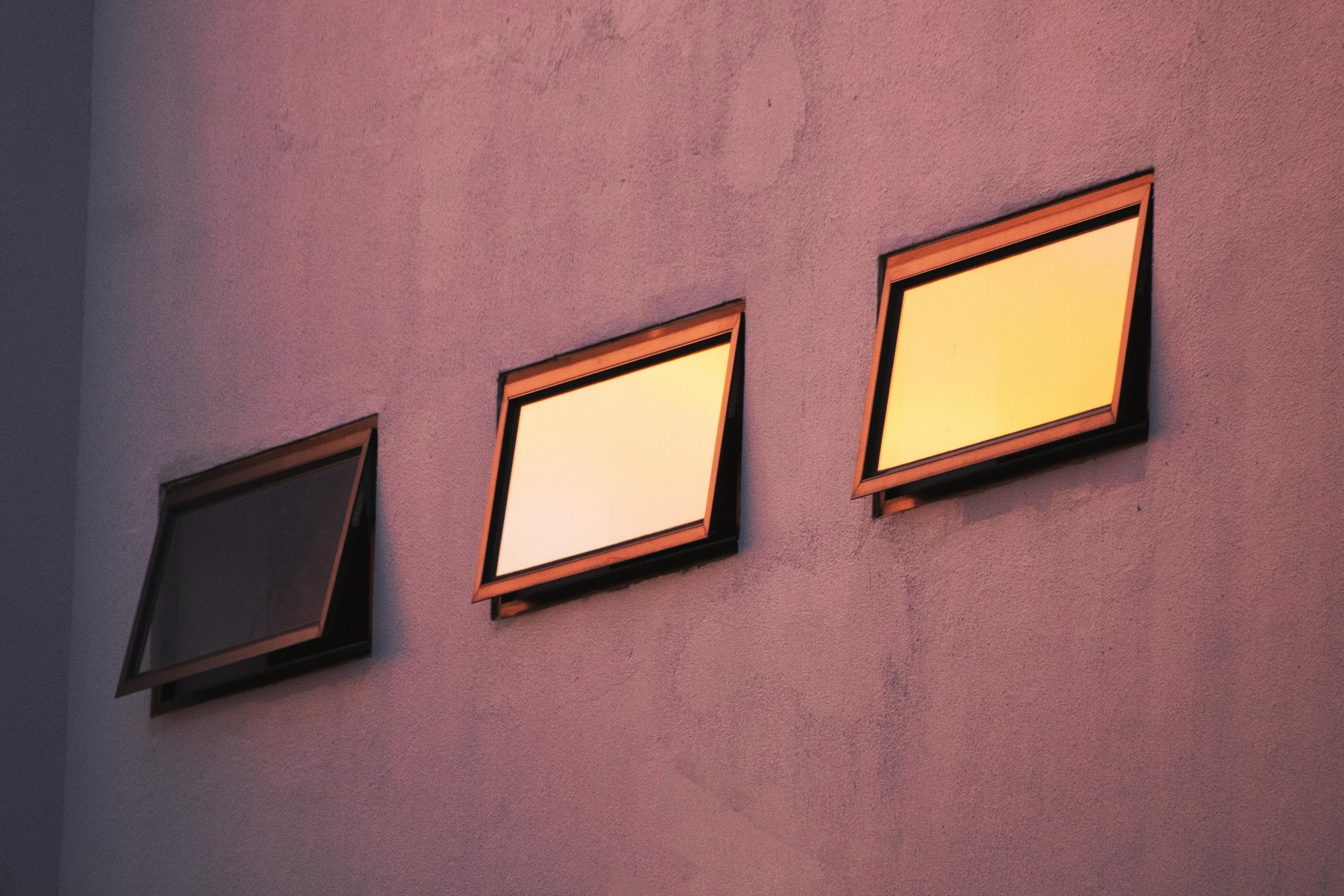Three Awning Windows on Plain Wall · Free Stock Photo