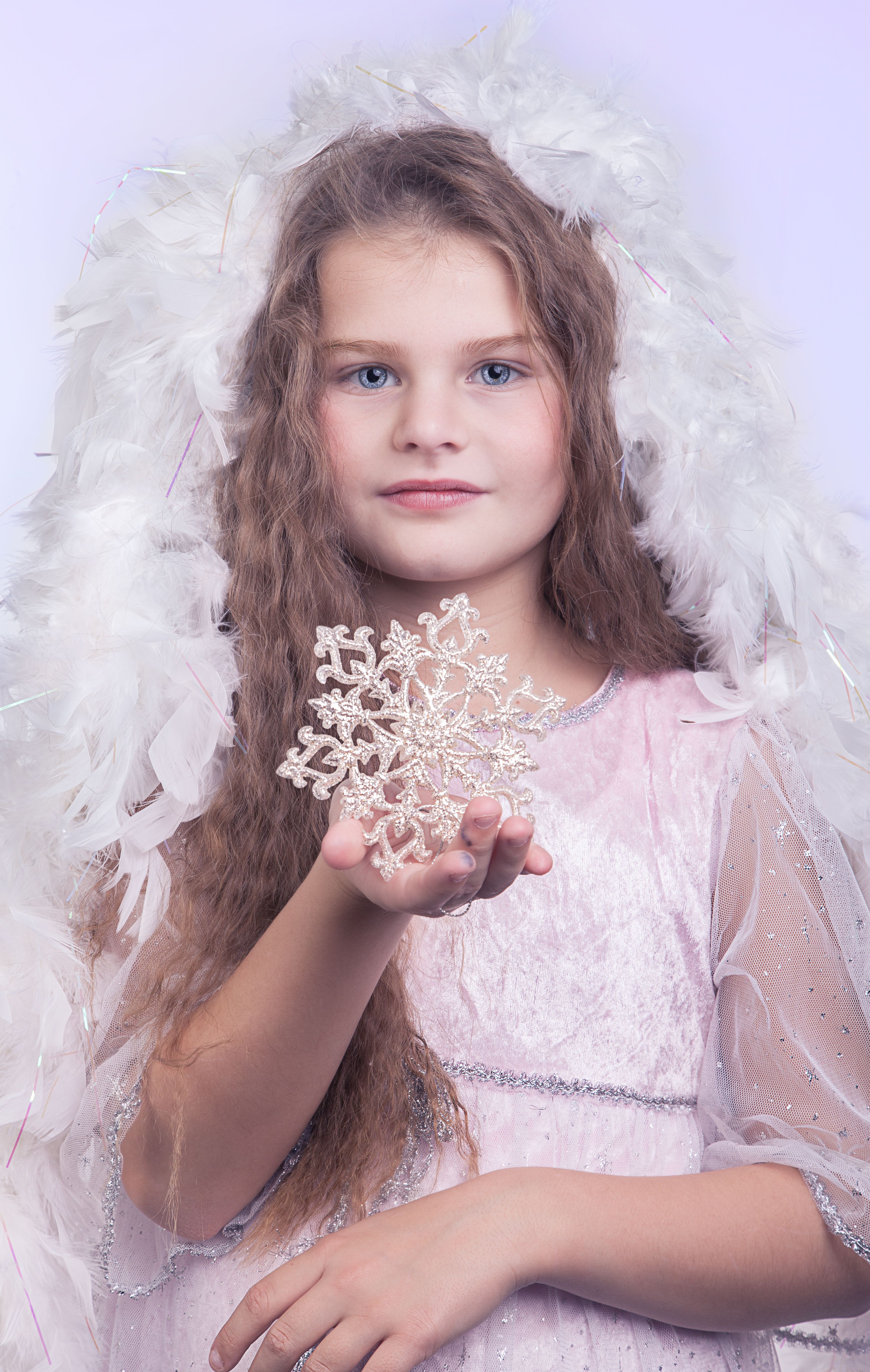 Girl in Angel Costume Holding a White Balloon · Free Stock Photo