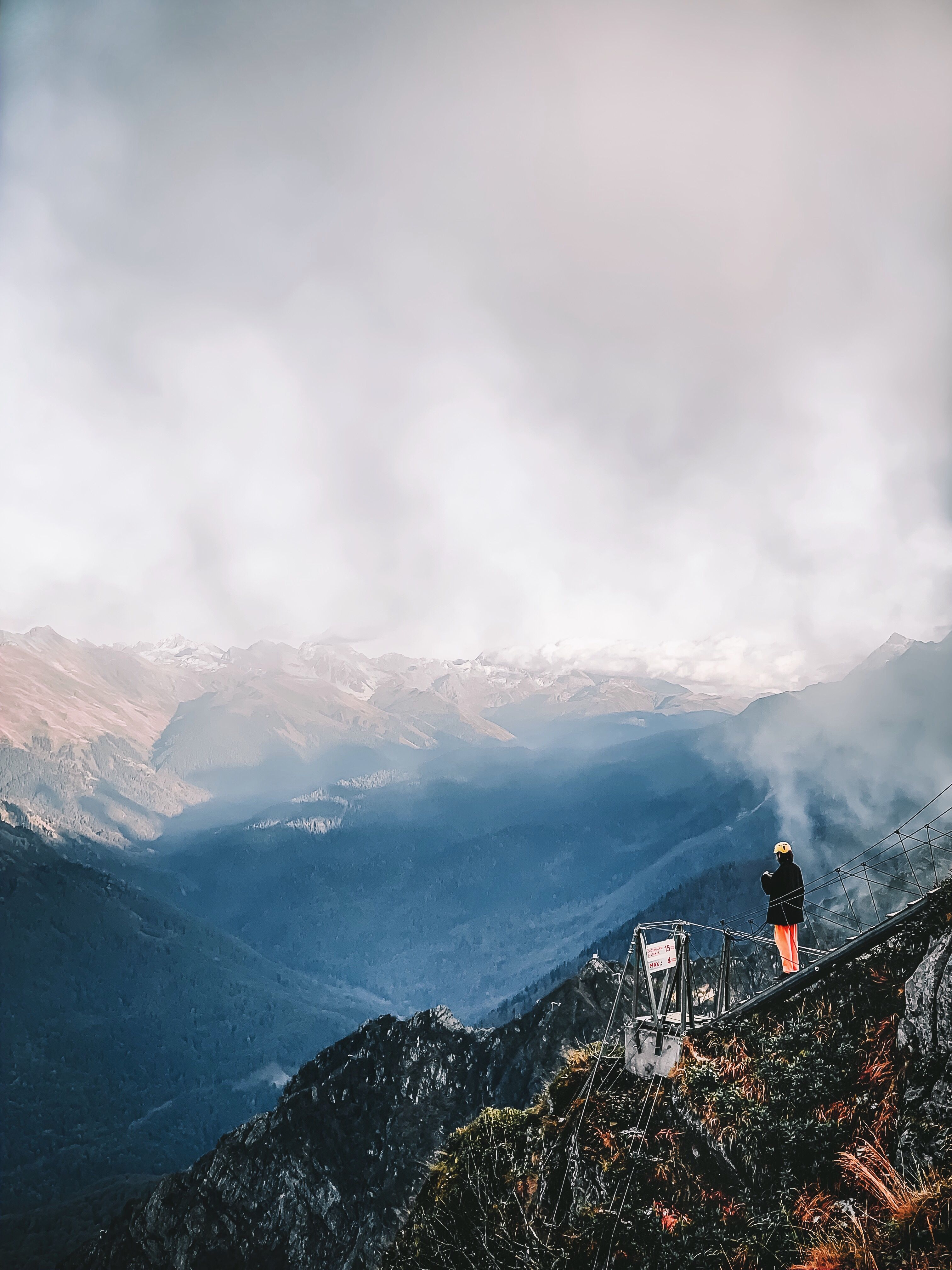 Hiker Admiring Mountain Views from Wooden Stairs of a Viewpoint · Free ...
