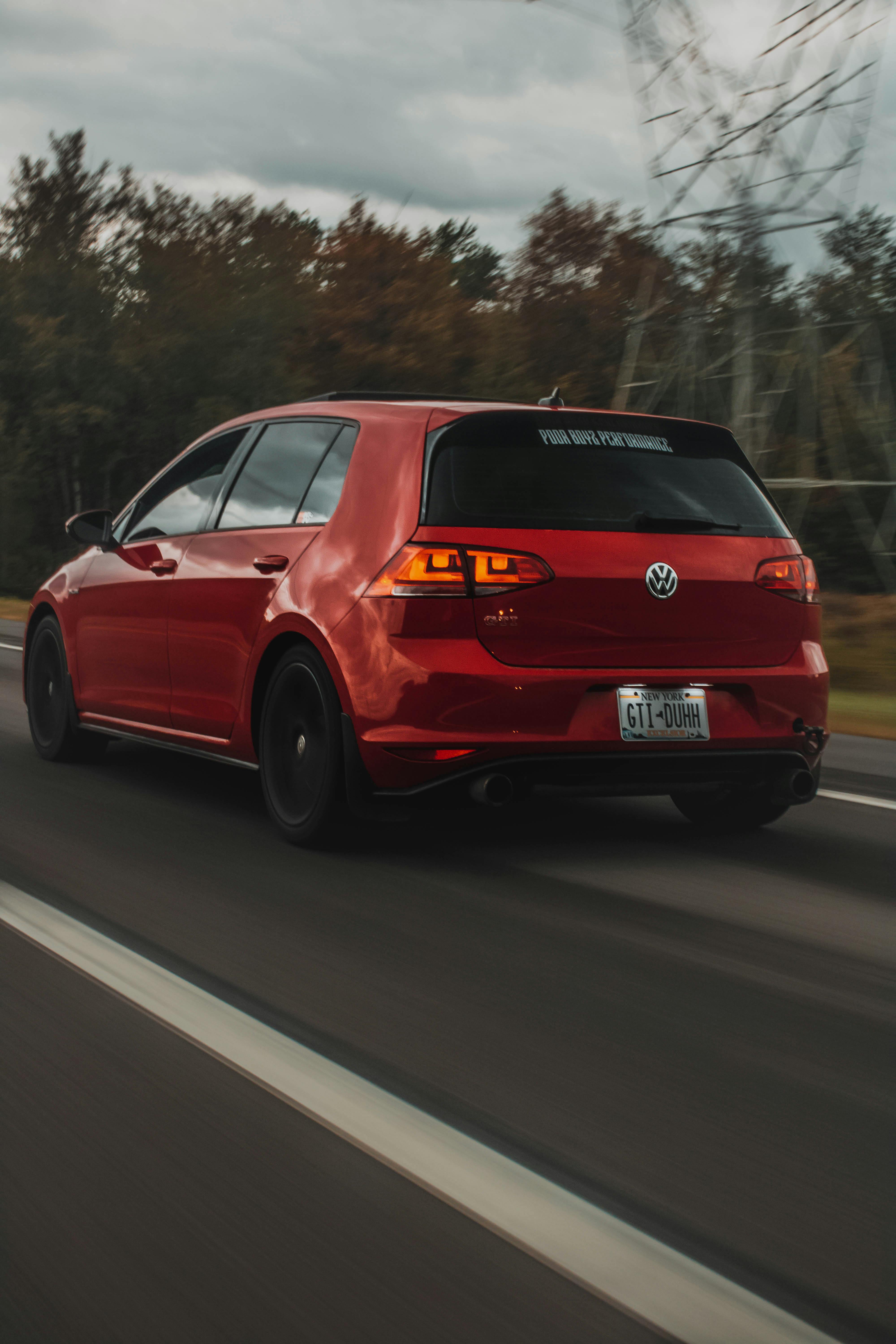 A Red Car on the Road · Free Stock Photo