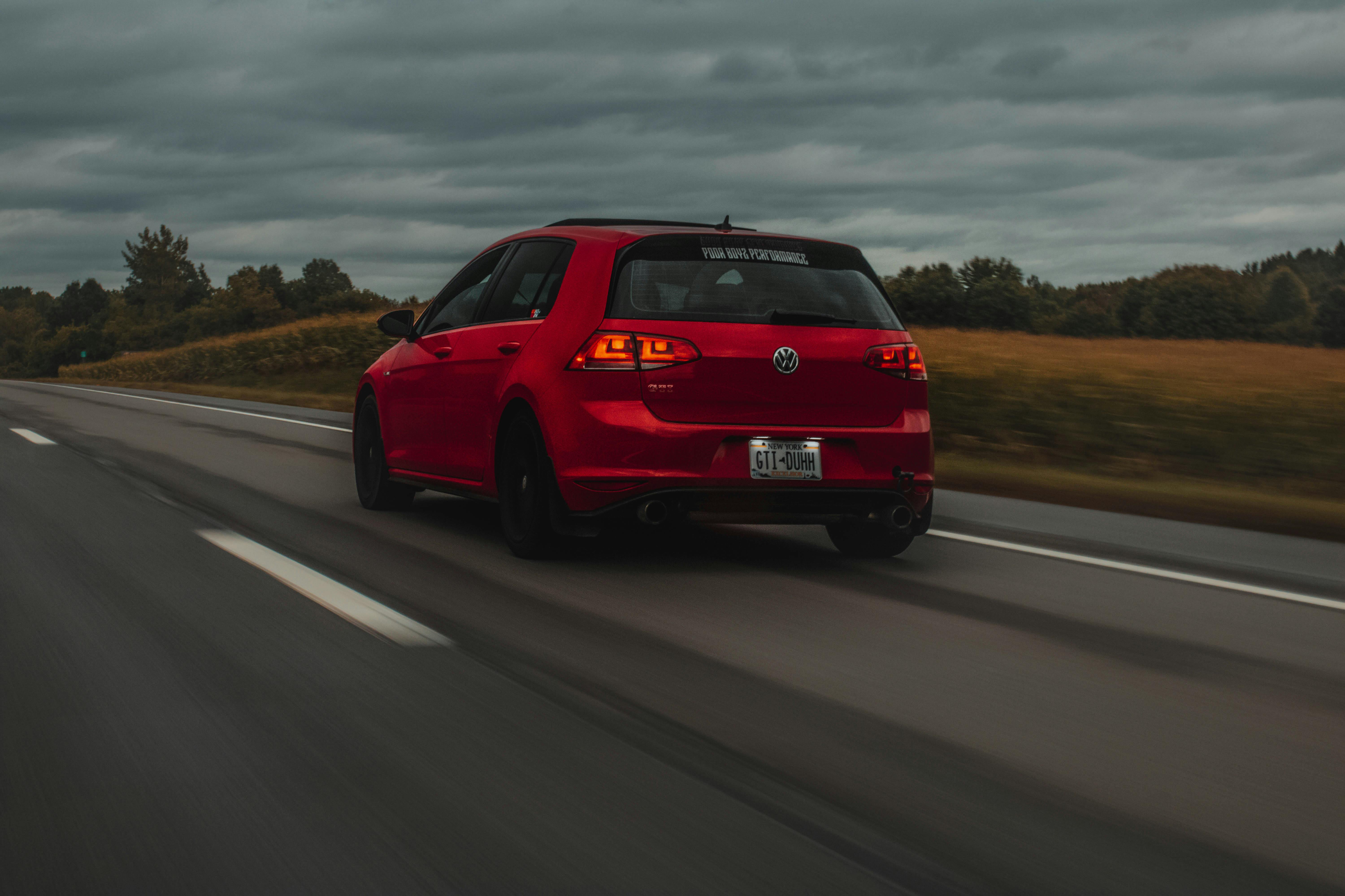 A Red Car on the Road · Free Stock Photo