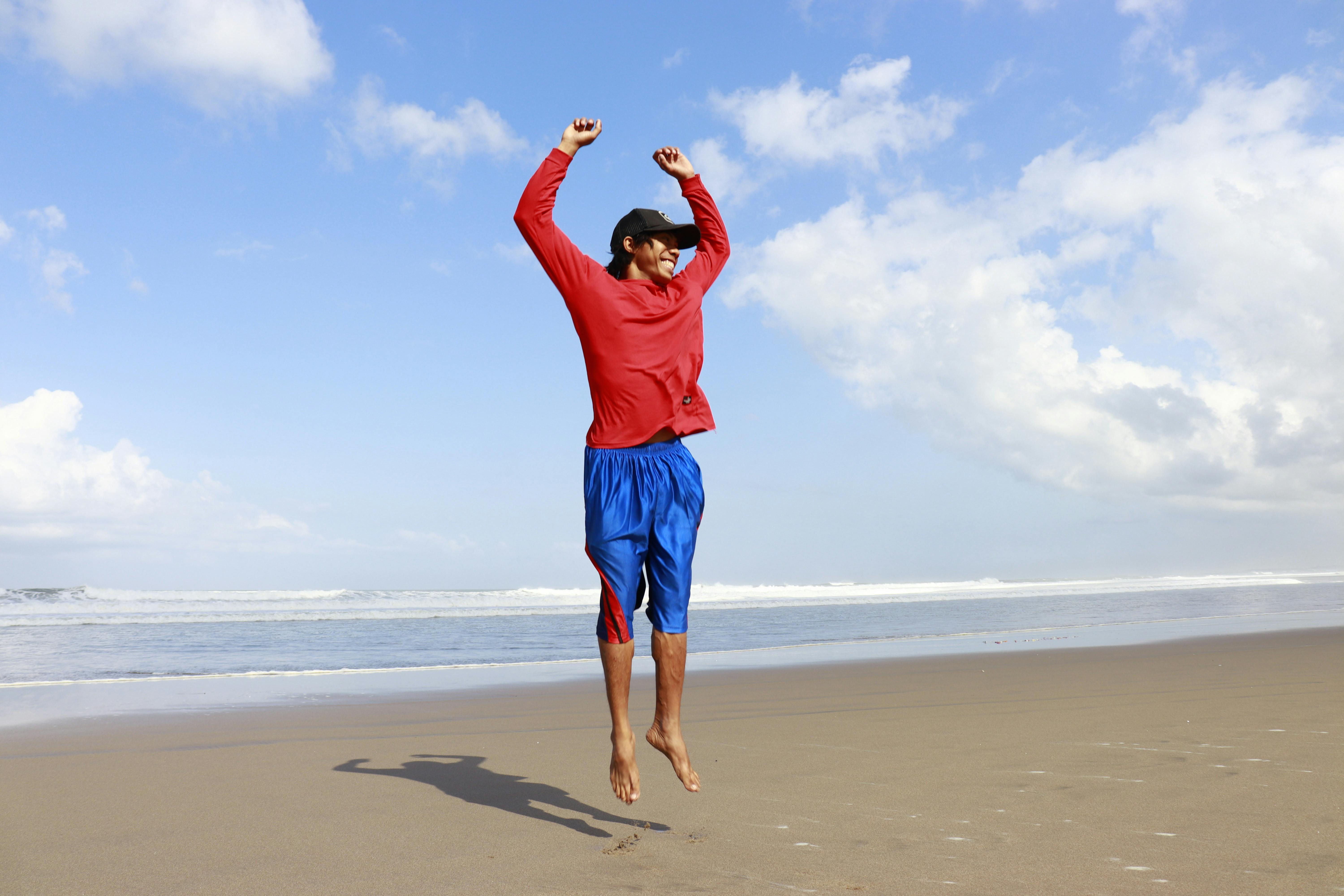 A Man Jumping in the Beach · Free Stock Photo