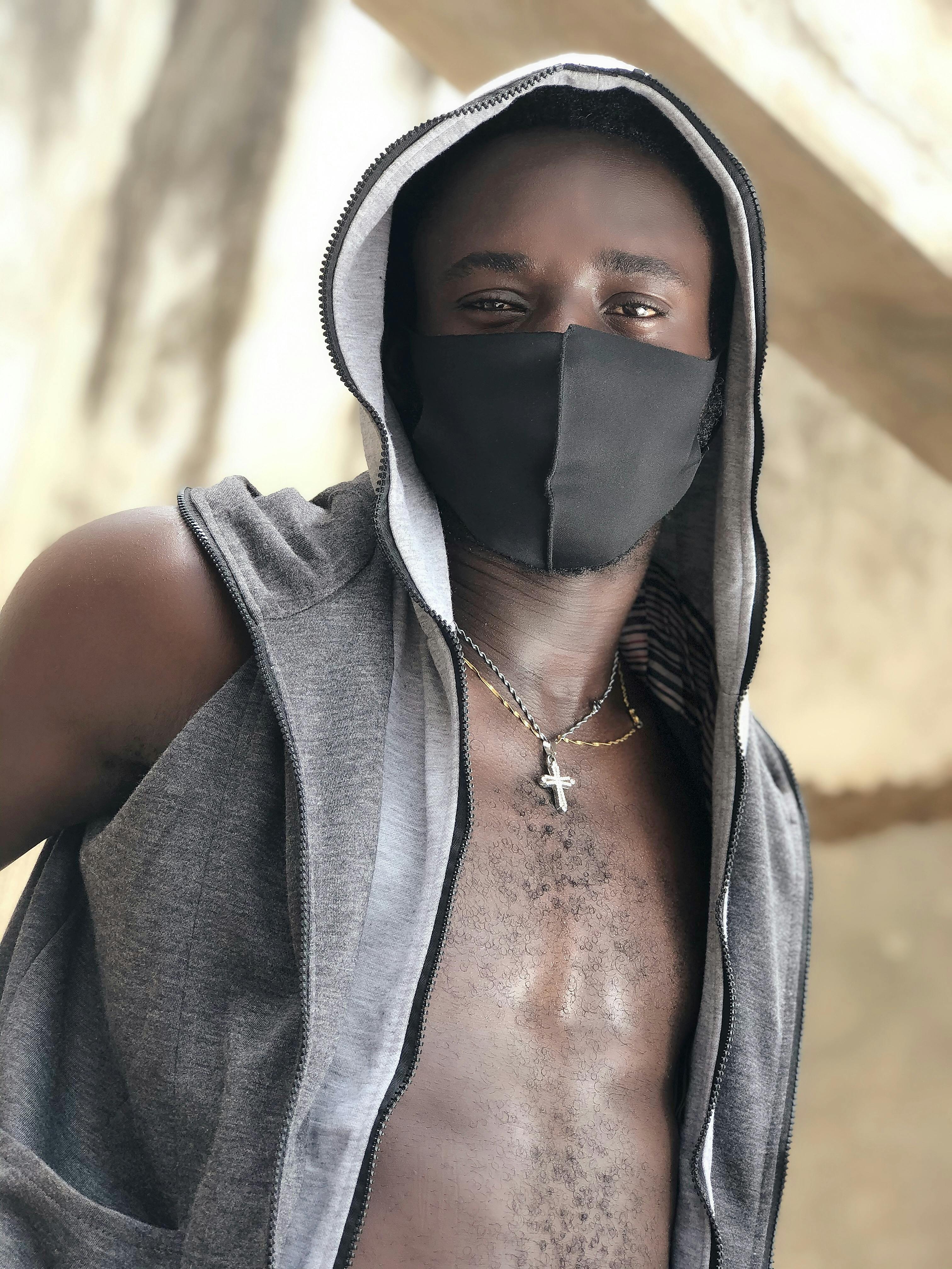 A Man in Gray Zip Up Hoodie Jacket Looking Sideways · Free Stock Photo