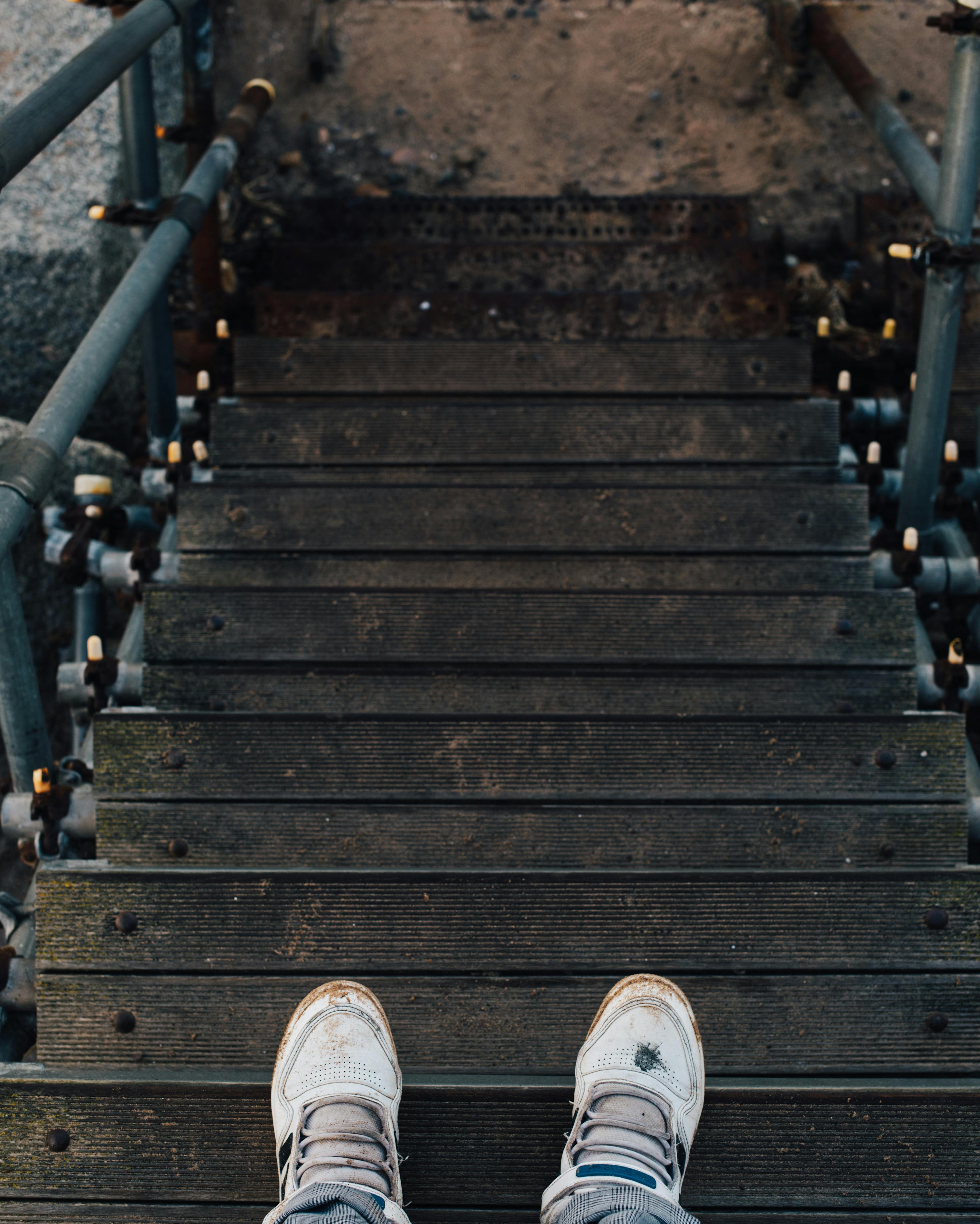 A Person Standing on Steps · Free Stock Photo