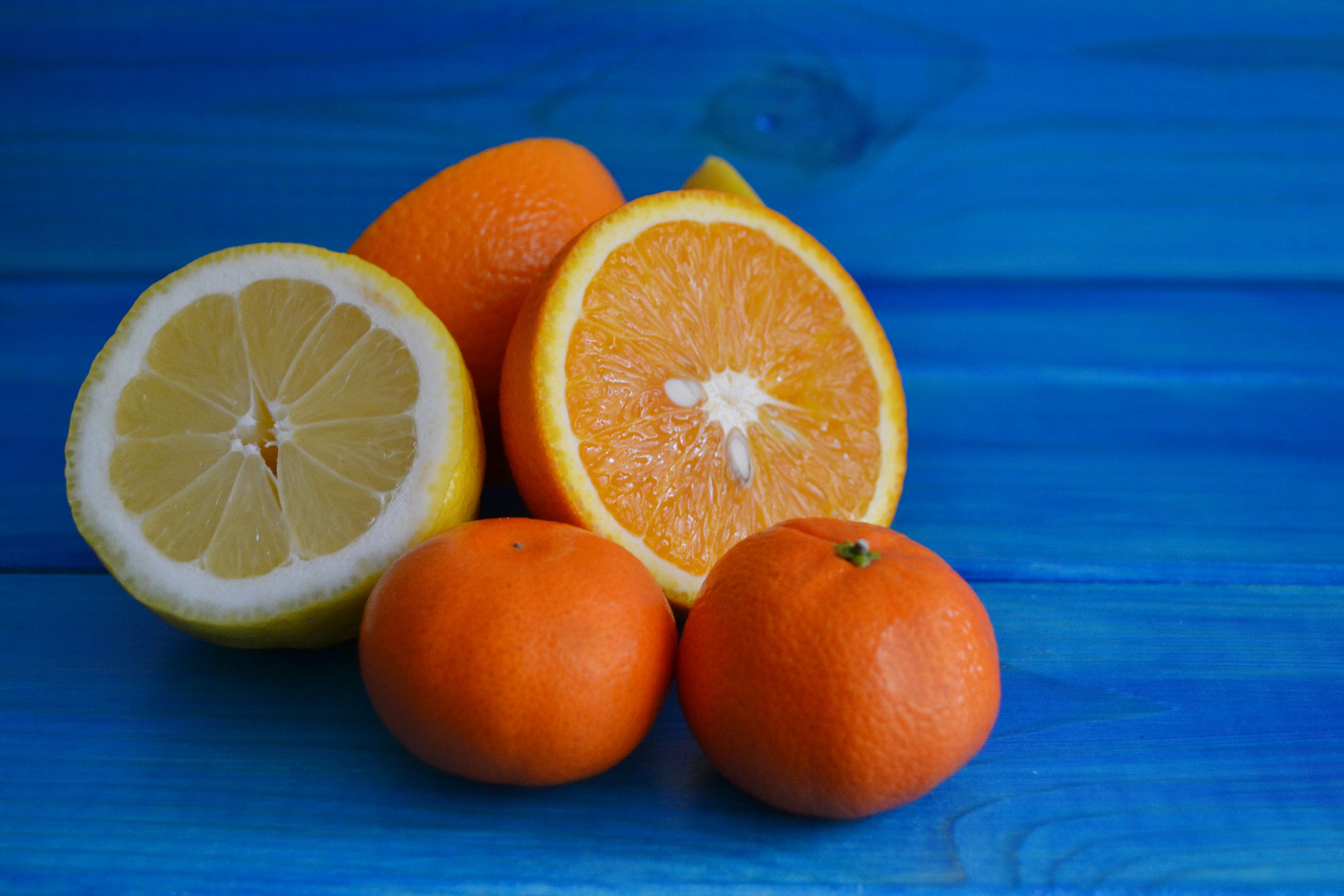 Photograph of Sliced Fruits Near a Wooden Frame · Free Stock Photo