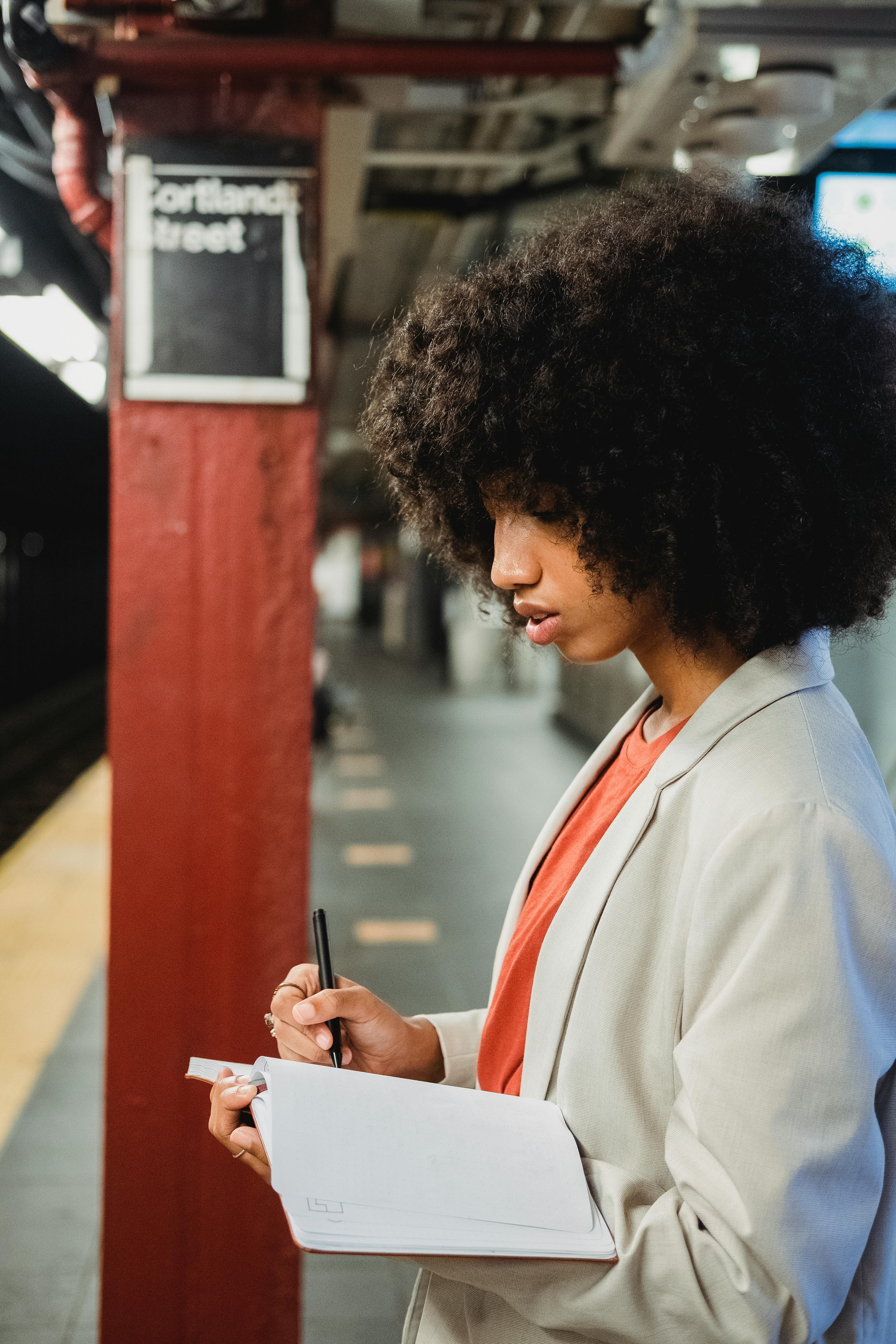 Girl reading a notebook · Free Stock Photo