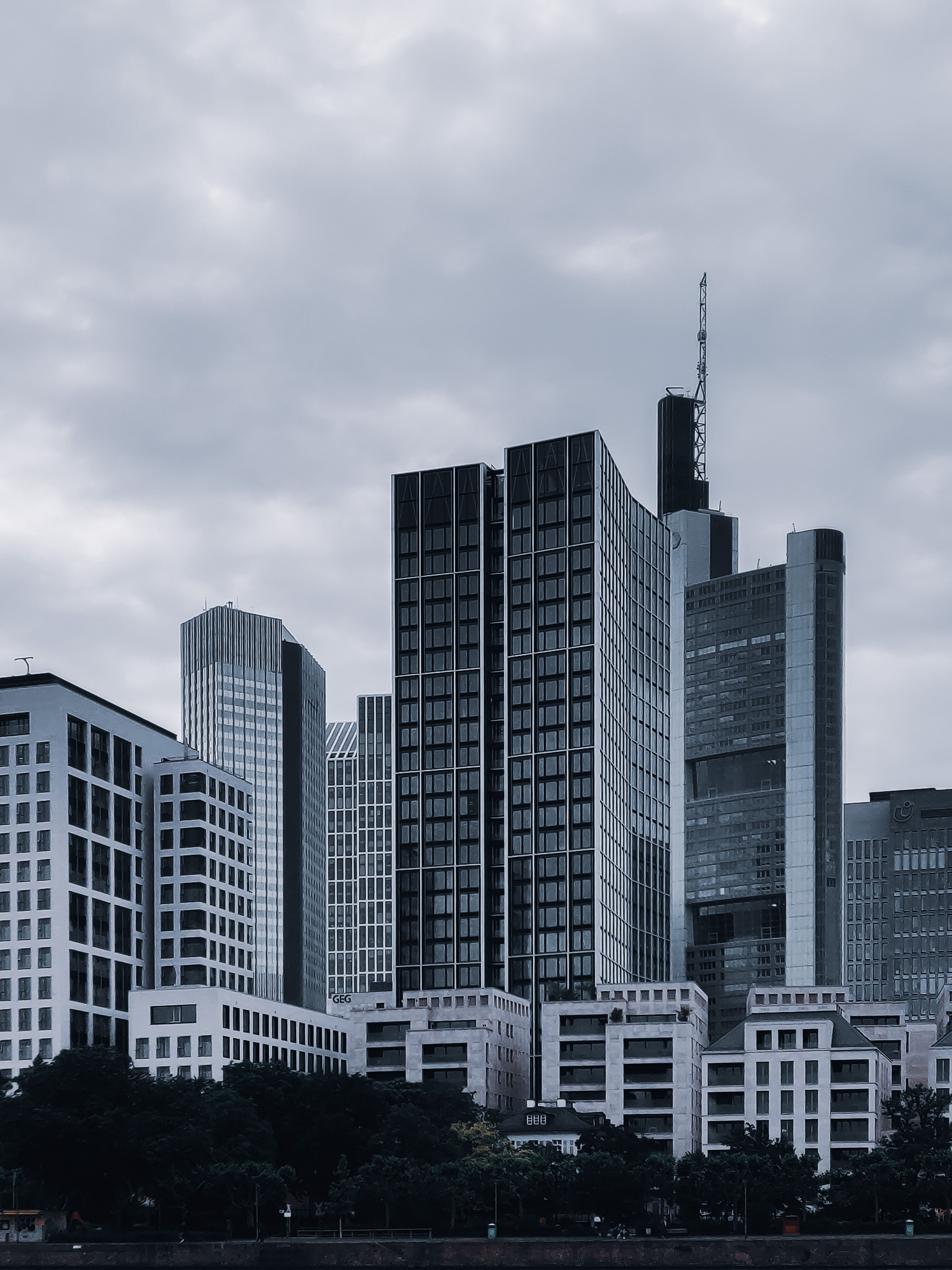 Cityscape of megapolis with contemporary architecture under blue sky ...
