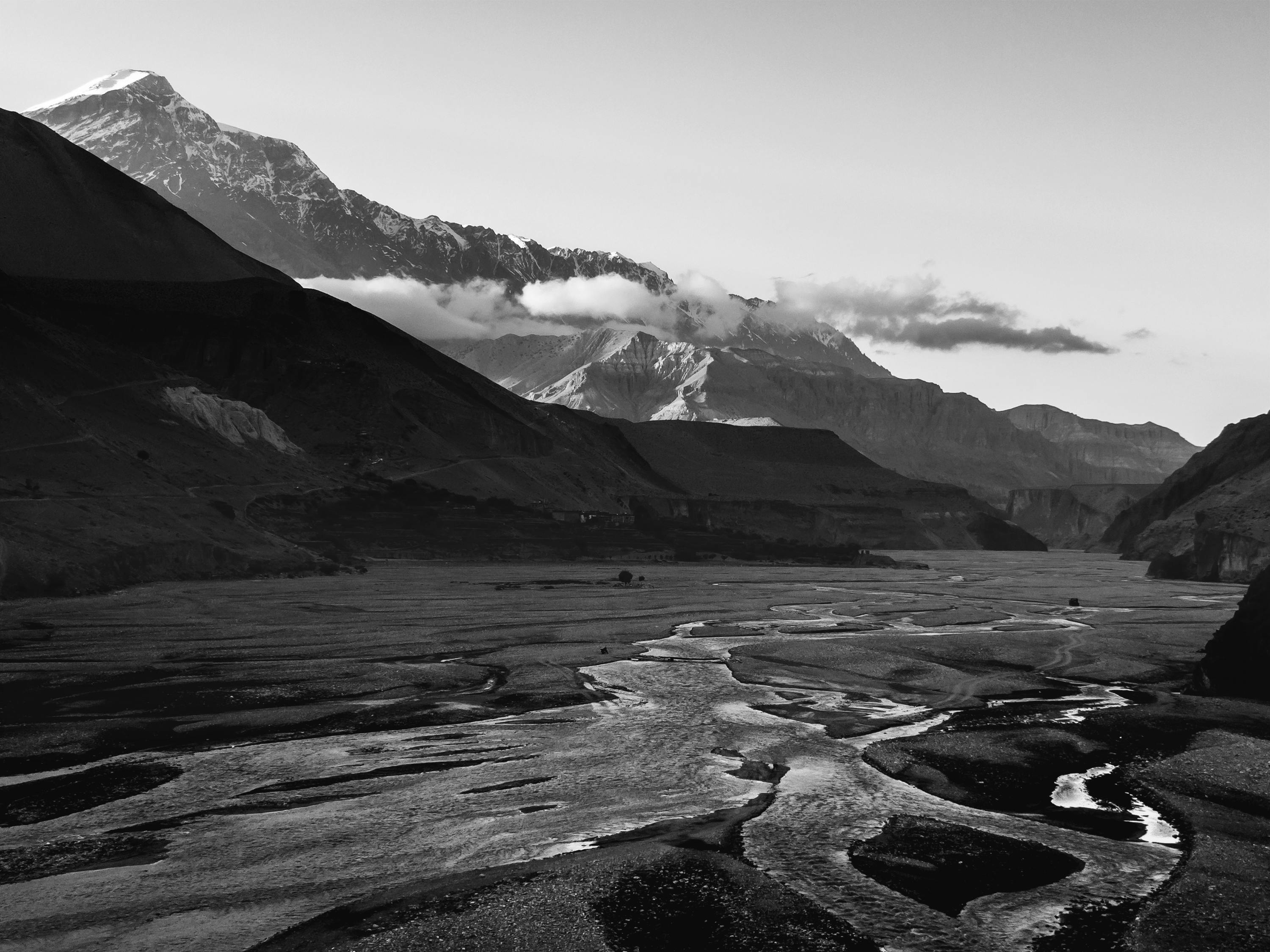 River Near Mountains in Black and White Photography · Free Stock Photo