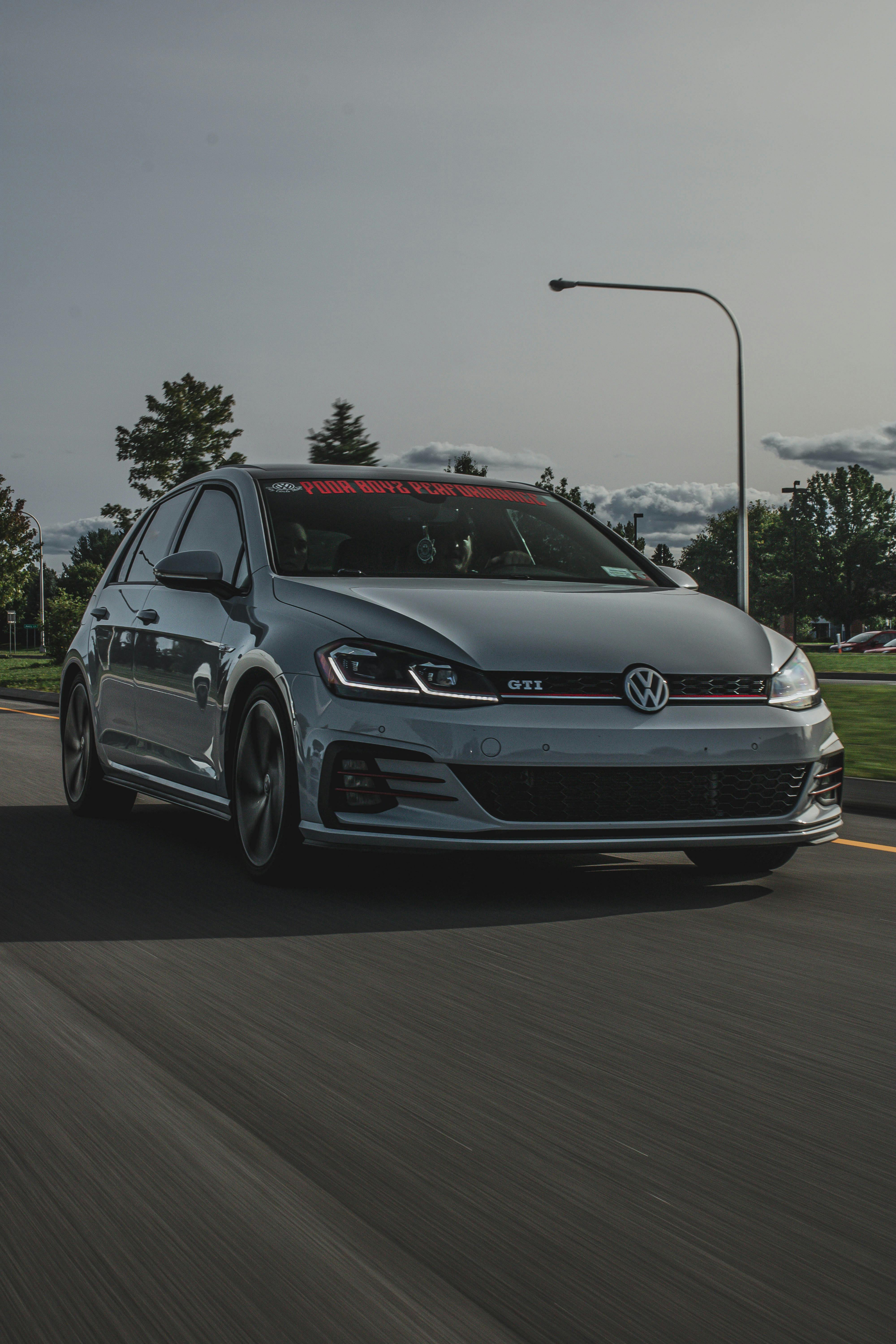 Photo of a Silver Volkswagen Car on the Road · Free Stock Photo
