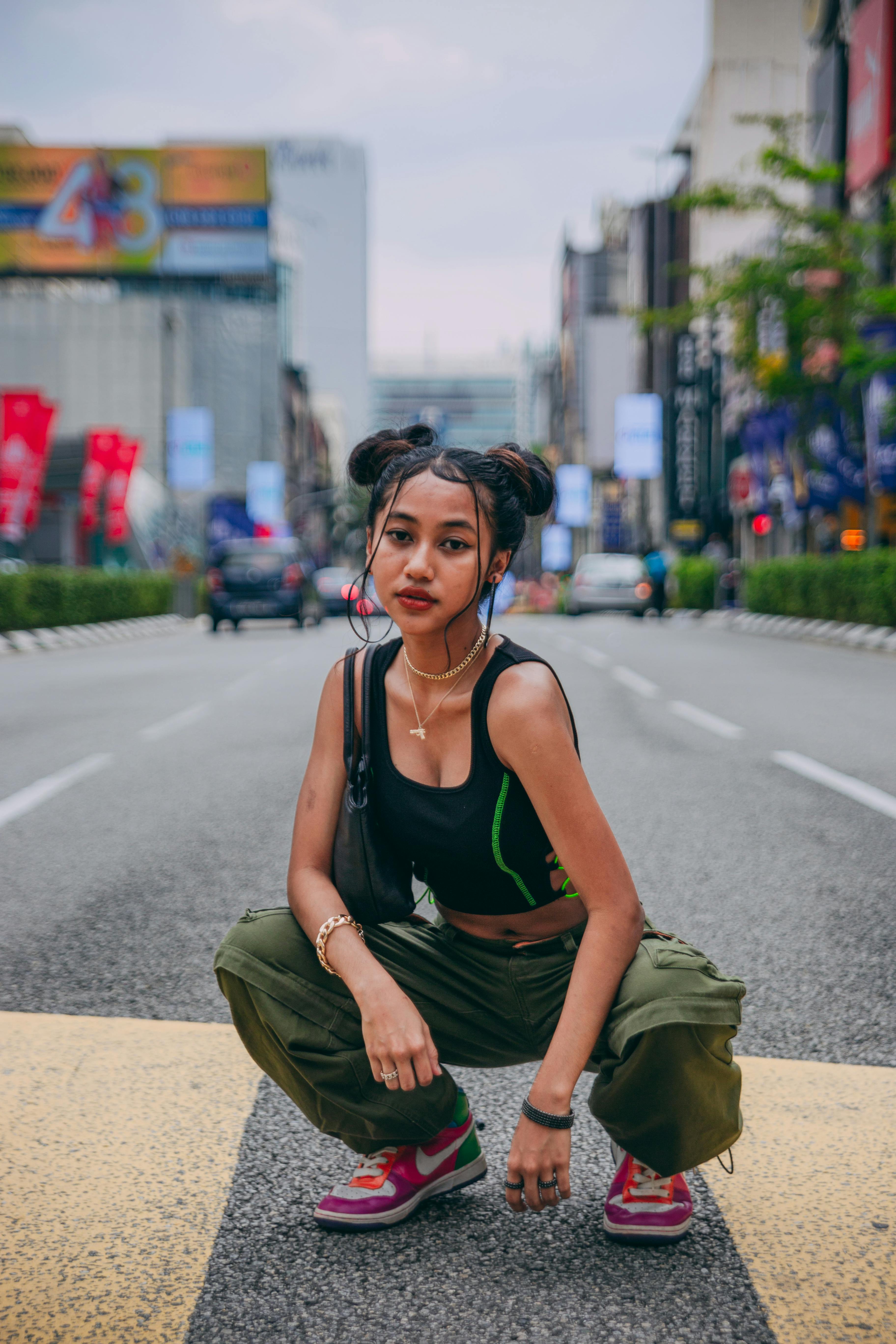Photo of a Woman in a Purple Blazer Crouching on a Billiard Table ...
