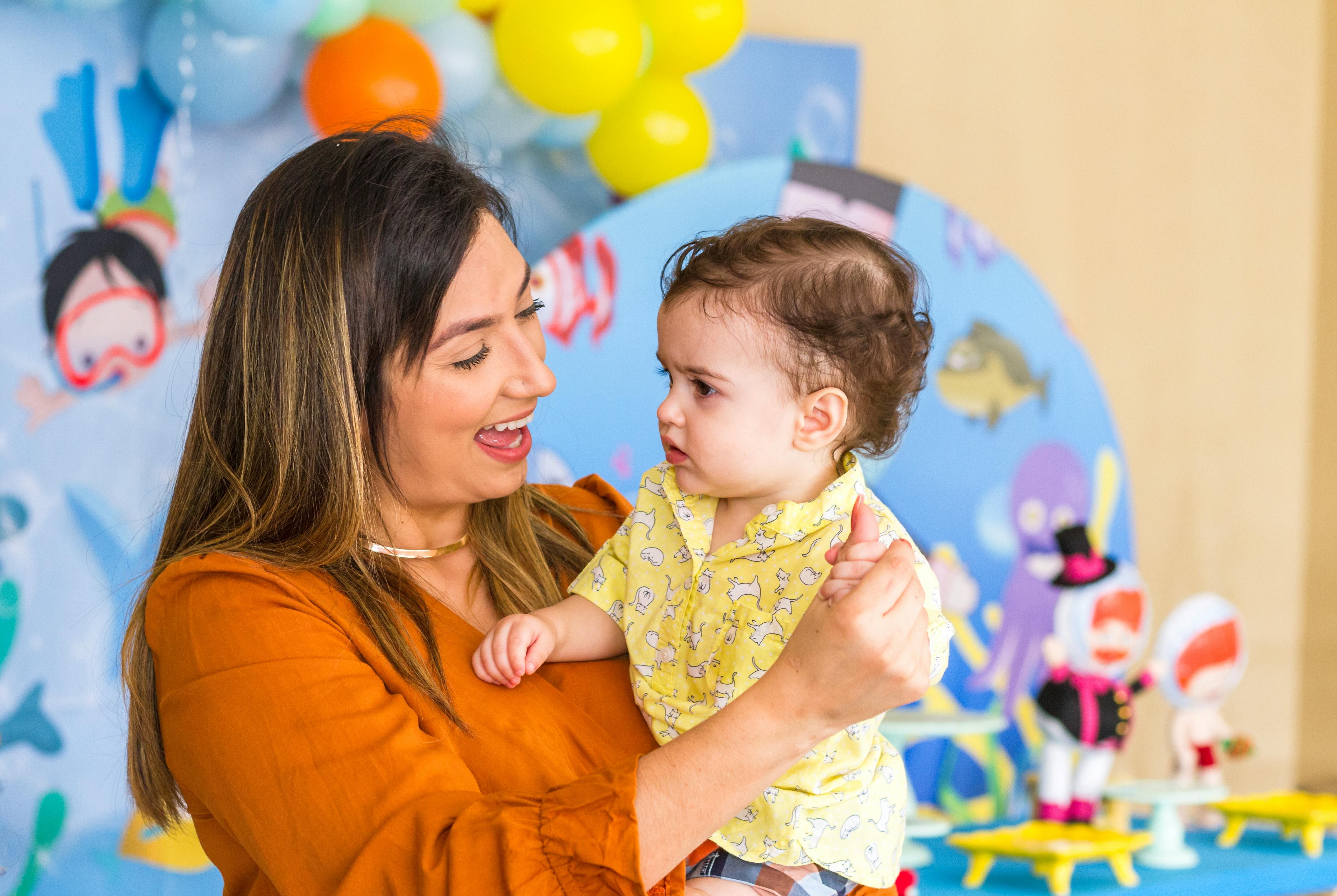 Woman Carrying Baby · Free Stock Photo