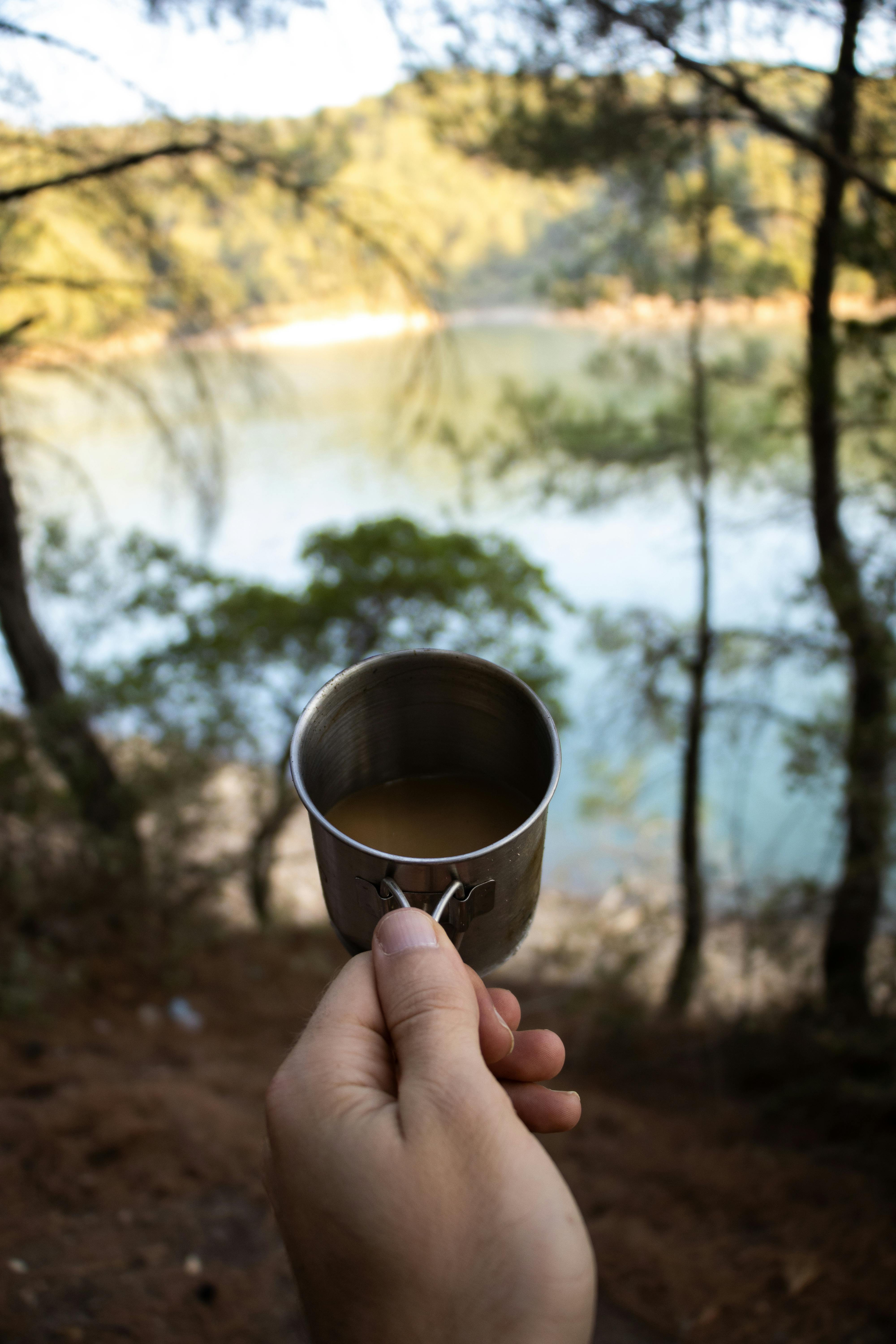 Close-Up Shot of a Person Holding a Cup of Drink · Free Stock Photo