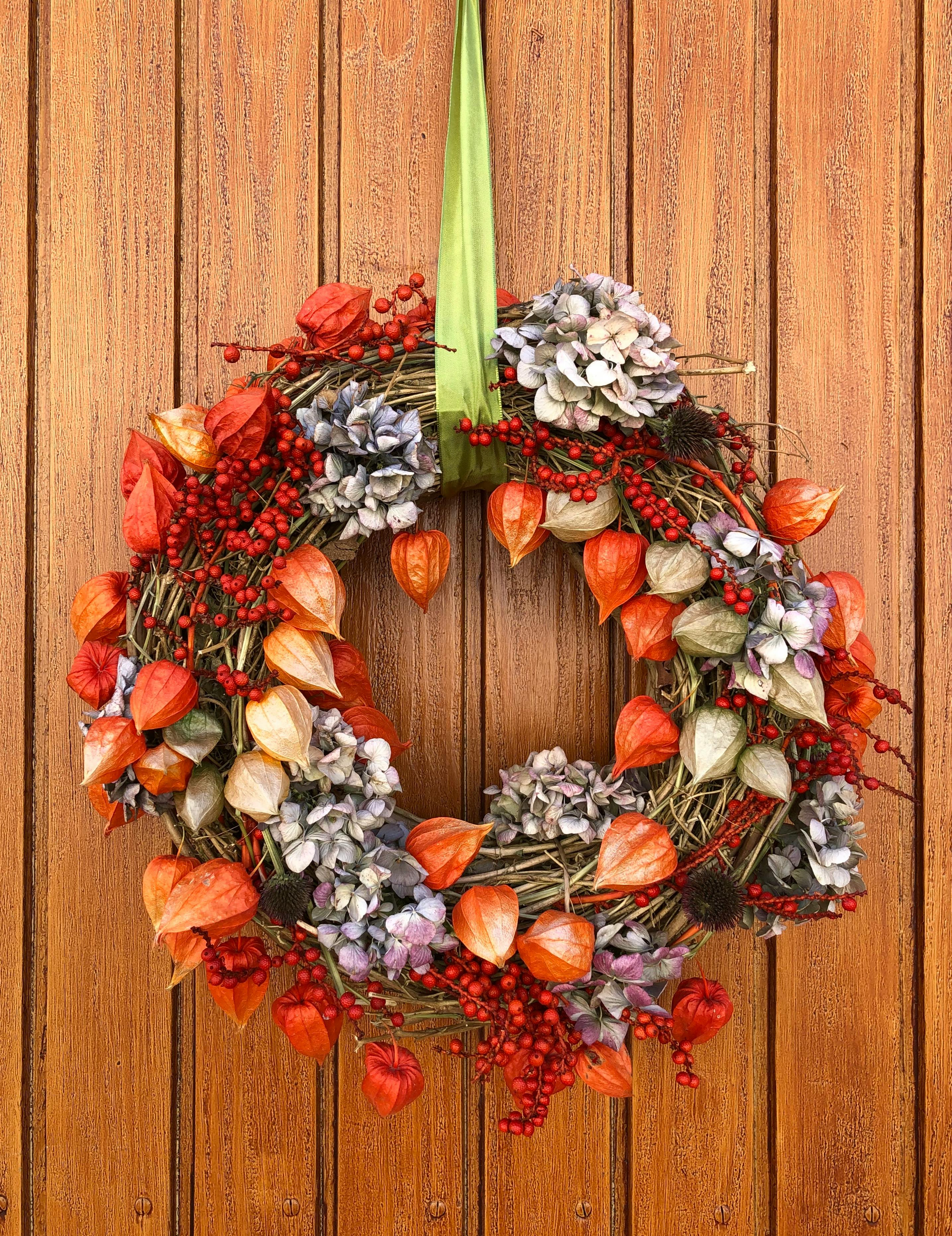 Close-Up Shot of a Christmas Wreath Hanged on the Door · Free Stock Photo
