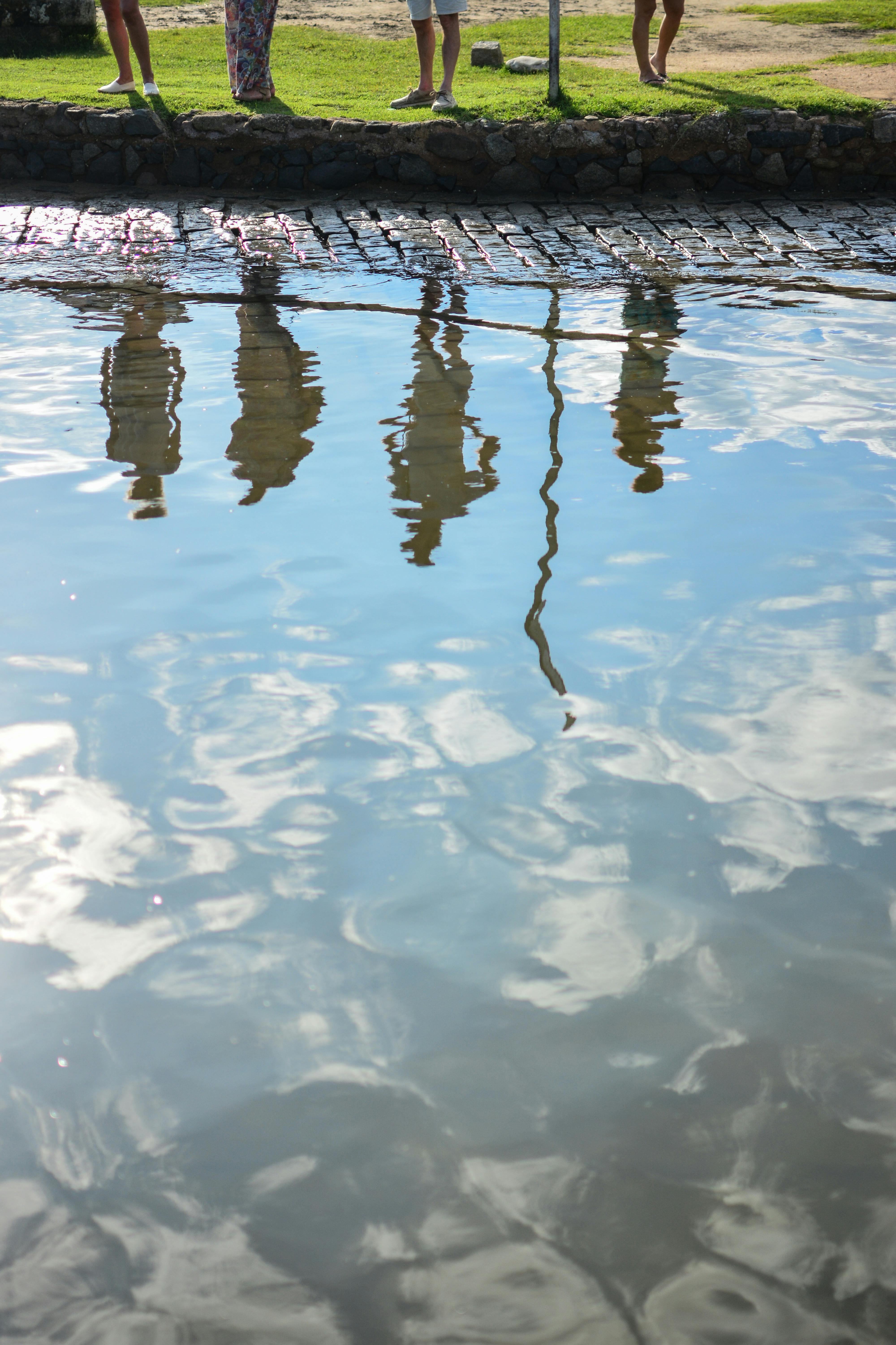 People Reflecting in Water · Free Stock Photo