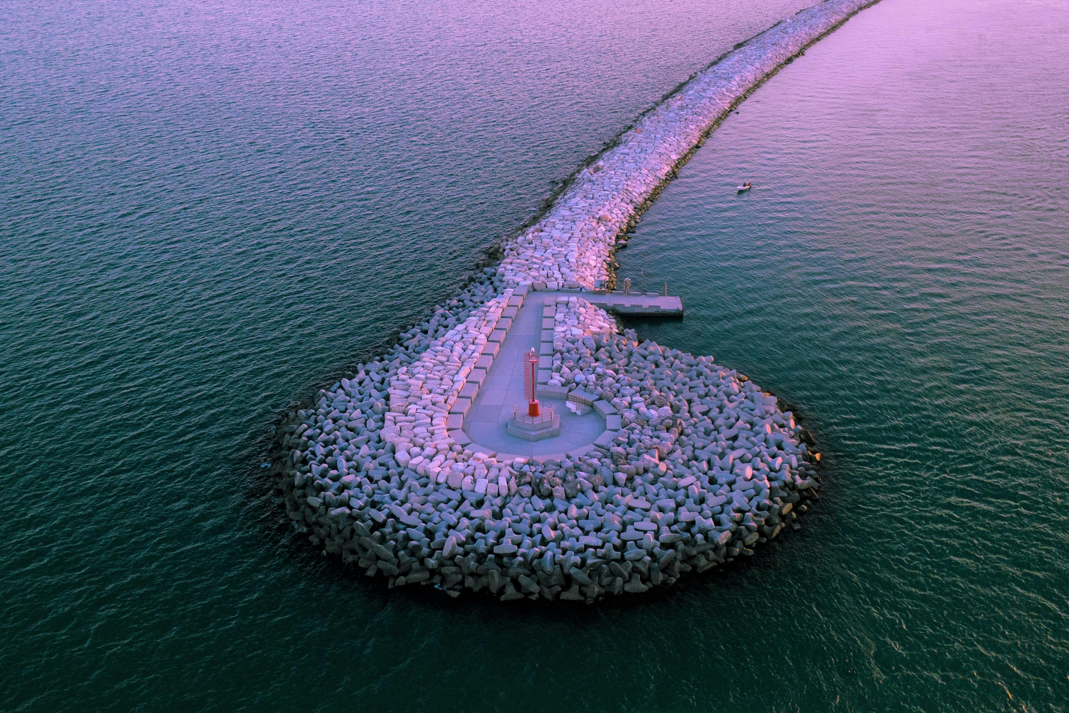 Aerial View of a Breakwater on a Sea · Free Stock Photo