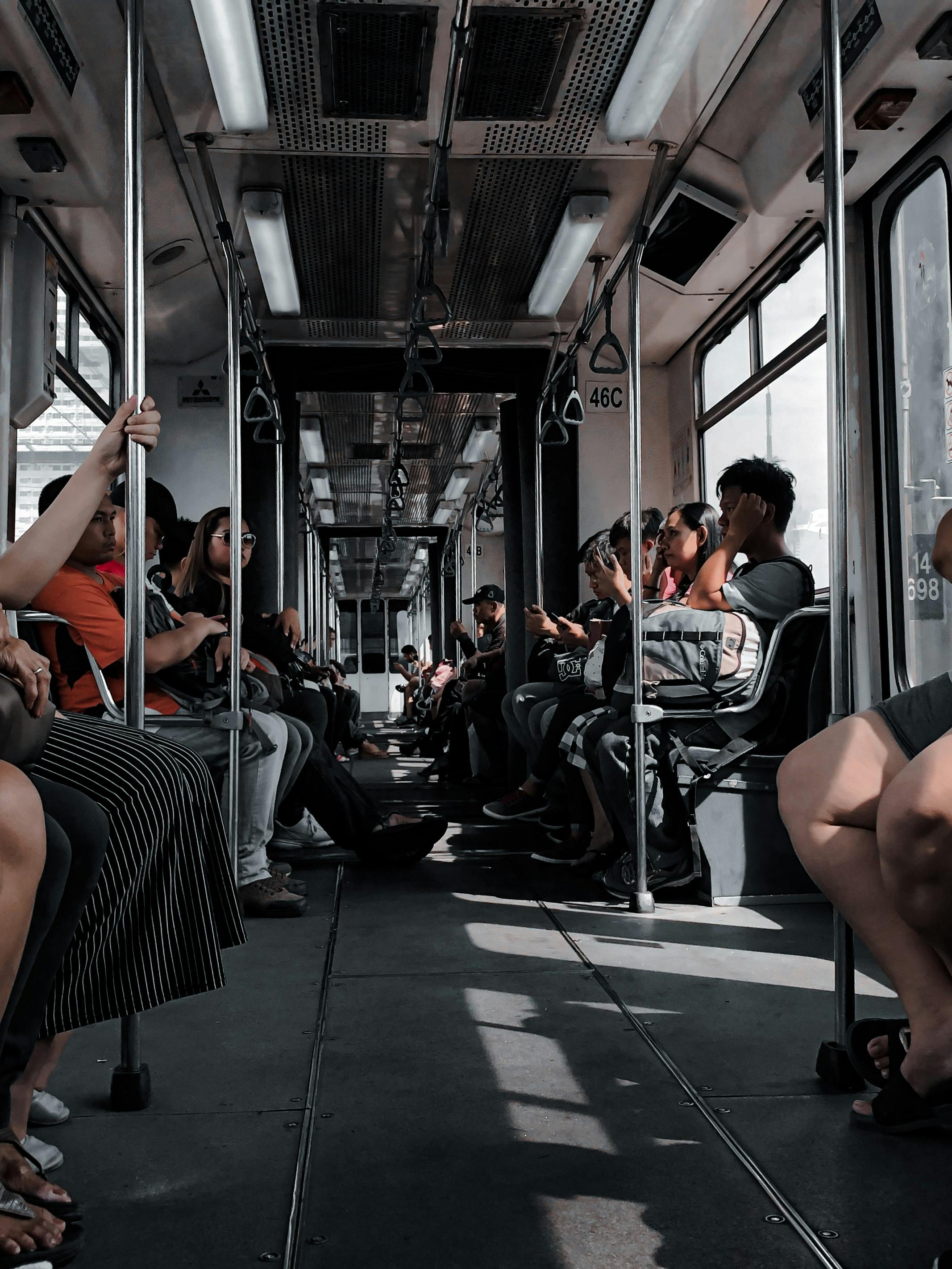 Diverse people riding in train of underground · Free Stock Photo