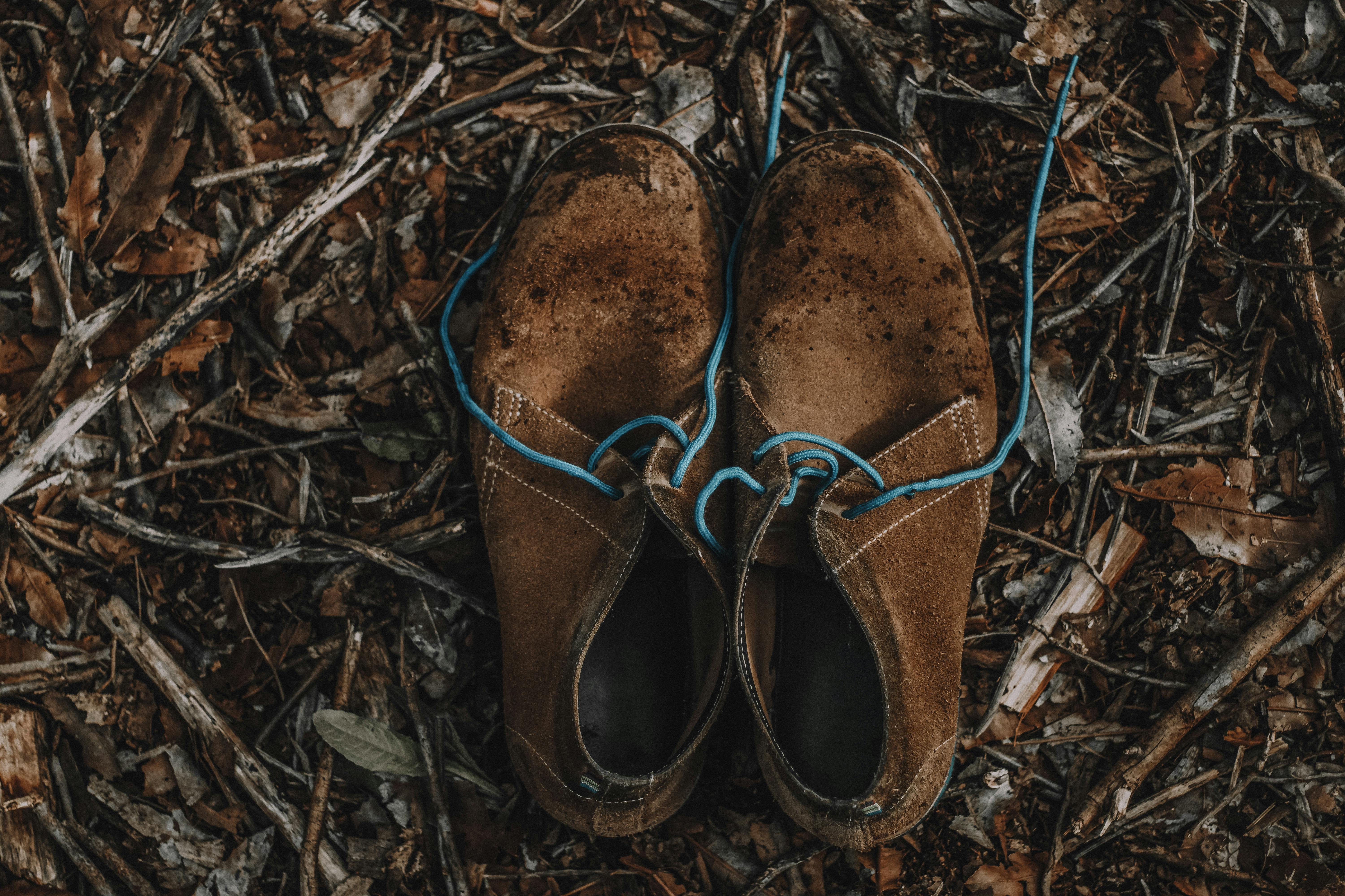 Old Worn Shoes on Ground · Free Stock Photo