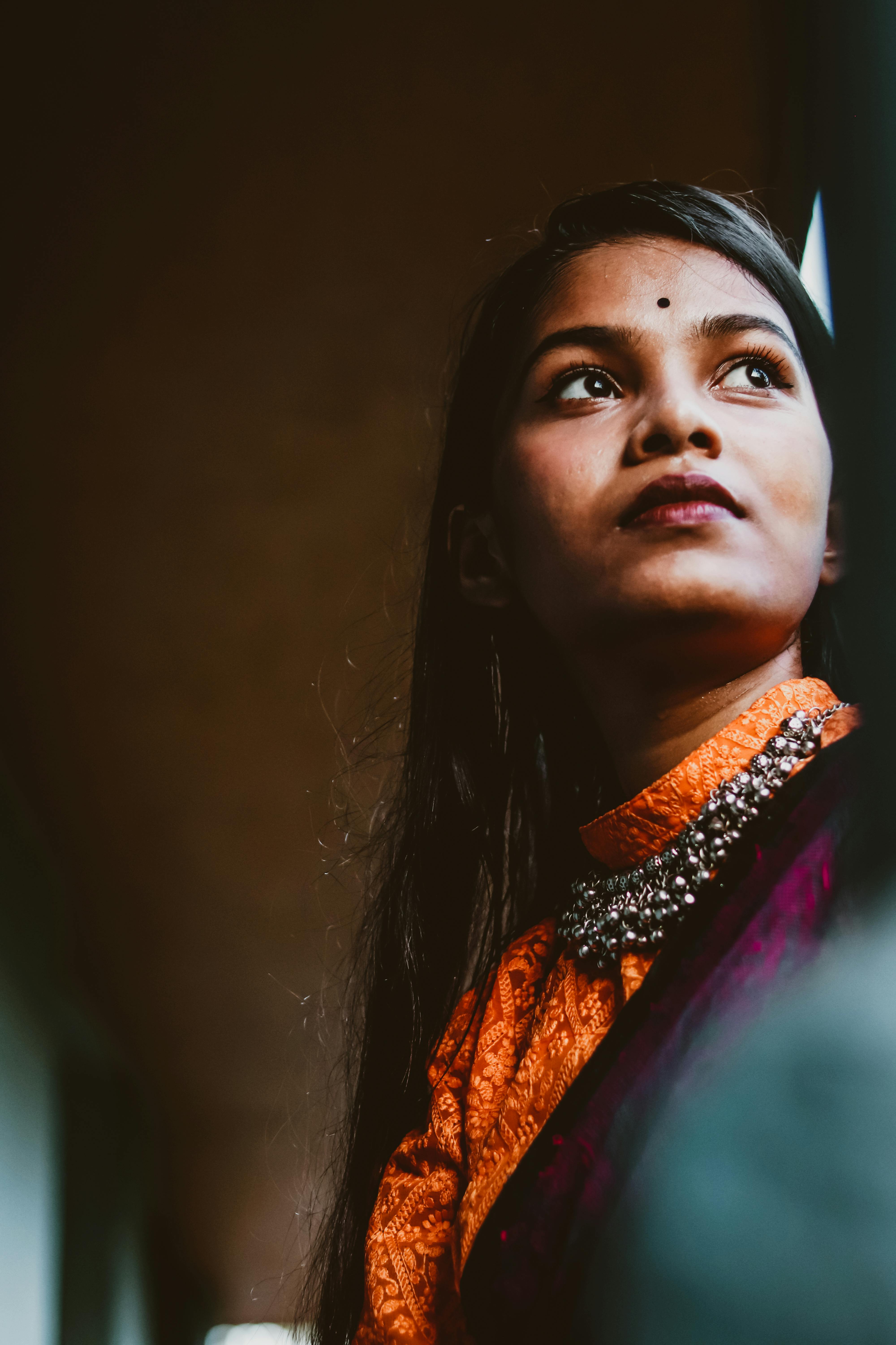 Dreamy Hindu woman in stylish apparel in building · Free Stock Photo