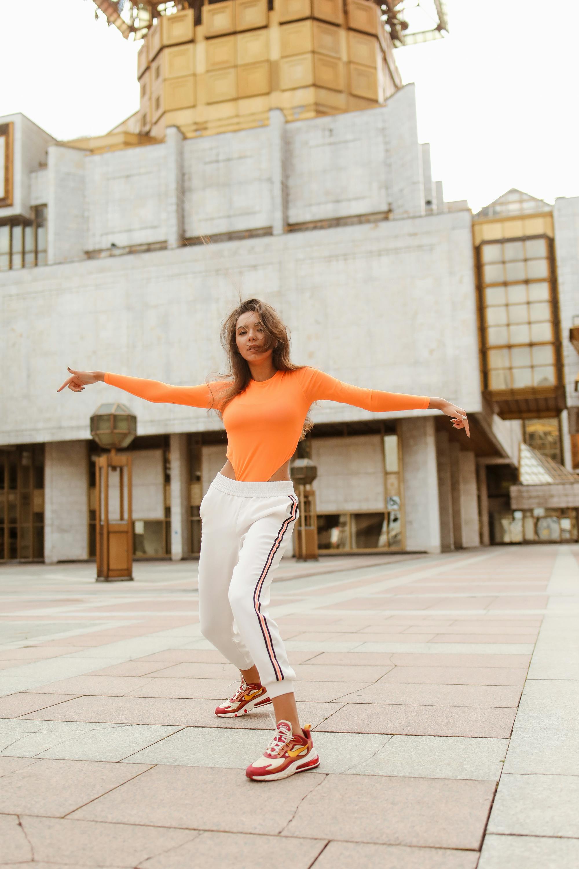 Brunette Woman Dancing with Messy Hair · Free Stock Photo