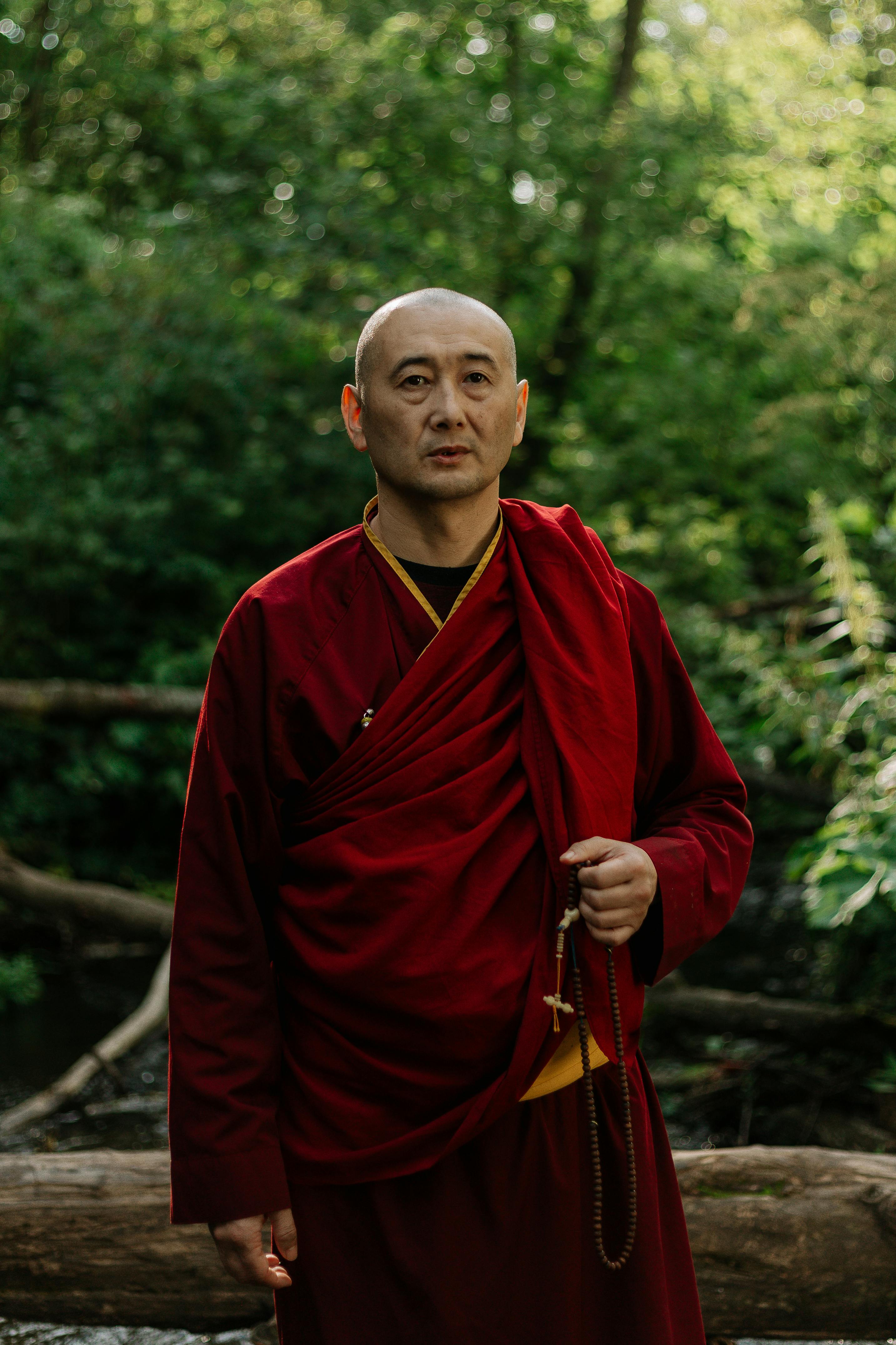 Buddhist Monk in Traditional Clothing · Free Stock Photo
