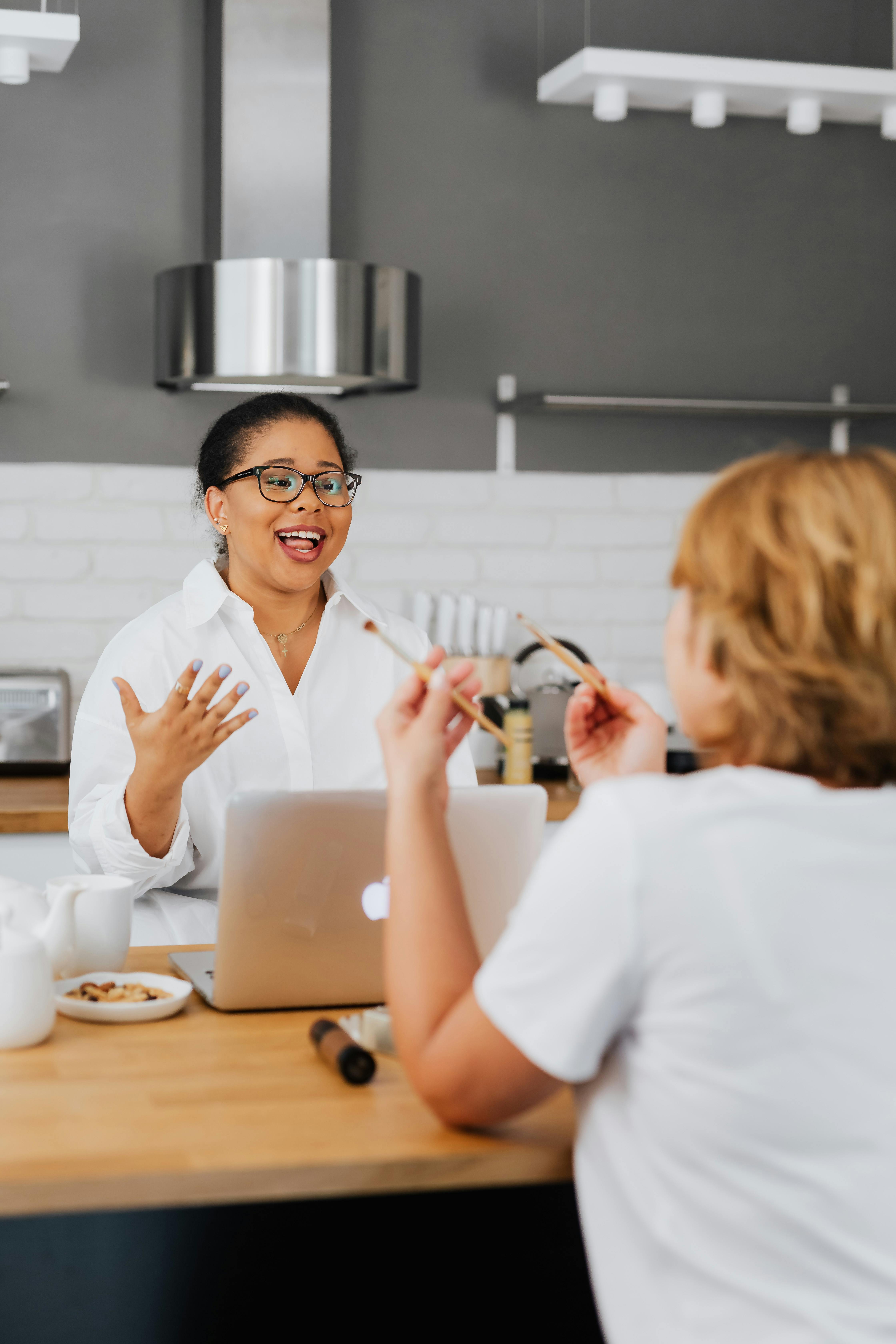 Two Women Having Conversation in the Kitchen · Free Stock Photo
