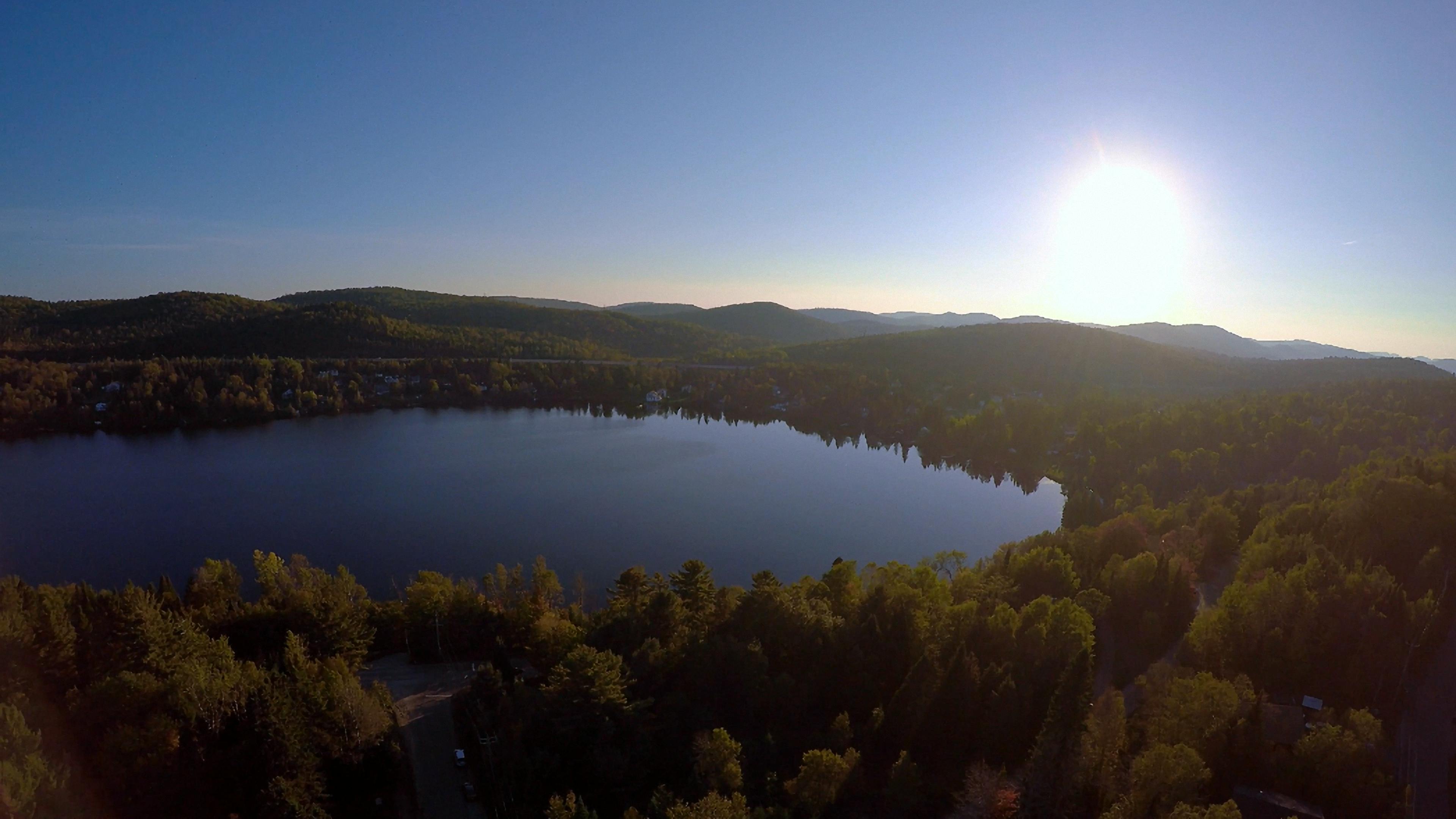 A Lake Surrounded by Trees during Daylight · Free Stock Photo