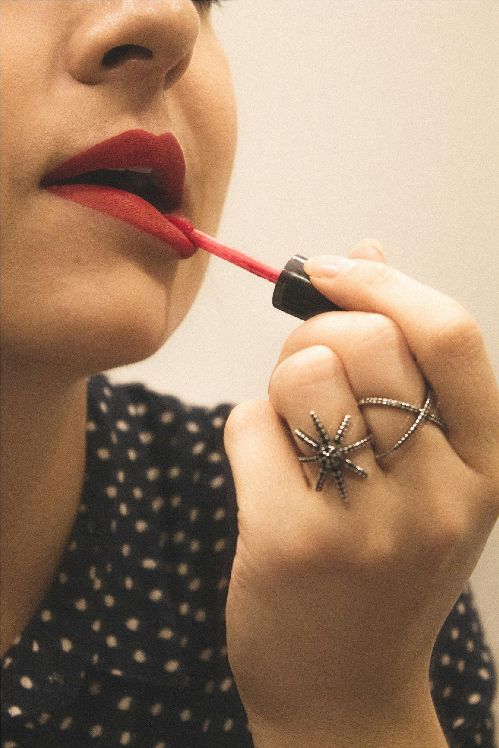 Close-Up Photo of a Lipstick Near Flowers · Free Stock Photo