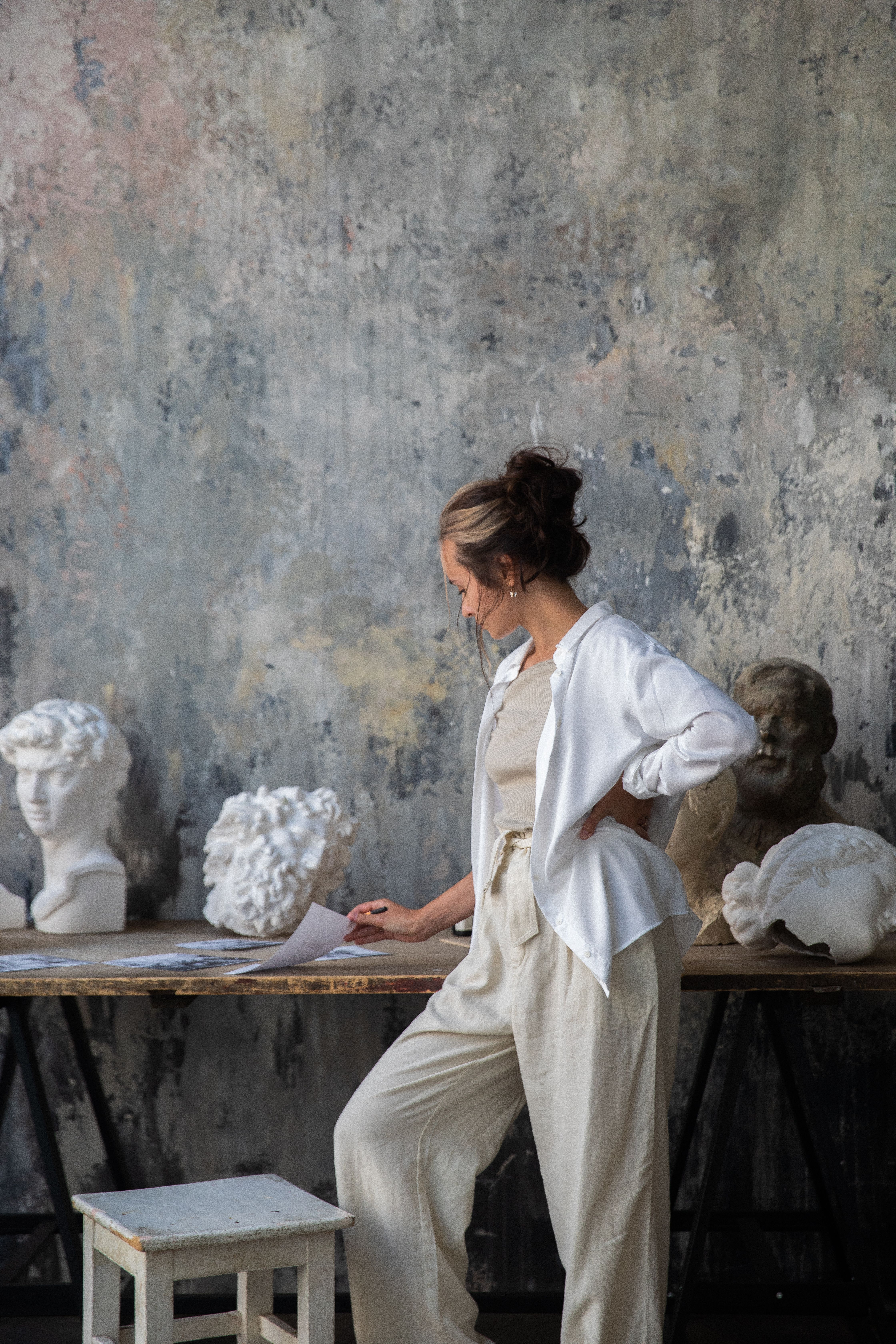 Woman Posing near Sculptures · Free Stock Photo