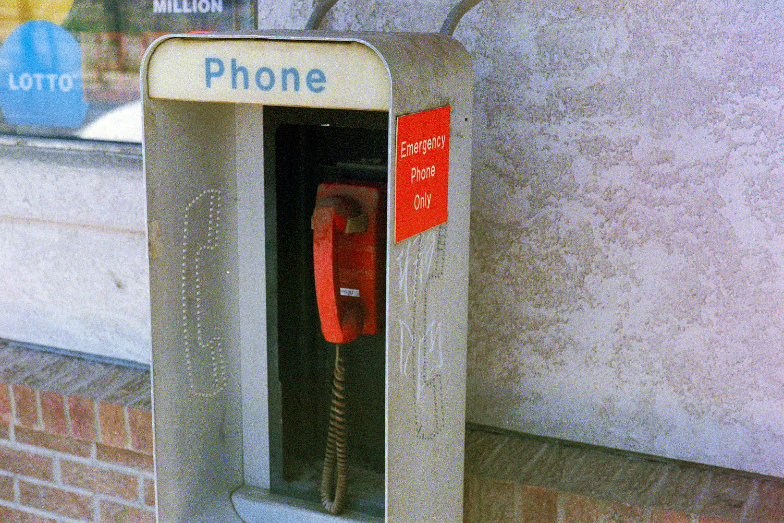 Red Emergency Telephone on a Wall · Free Stock Photo