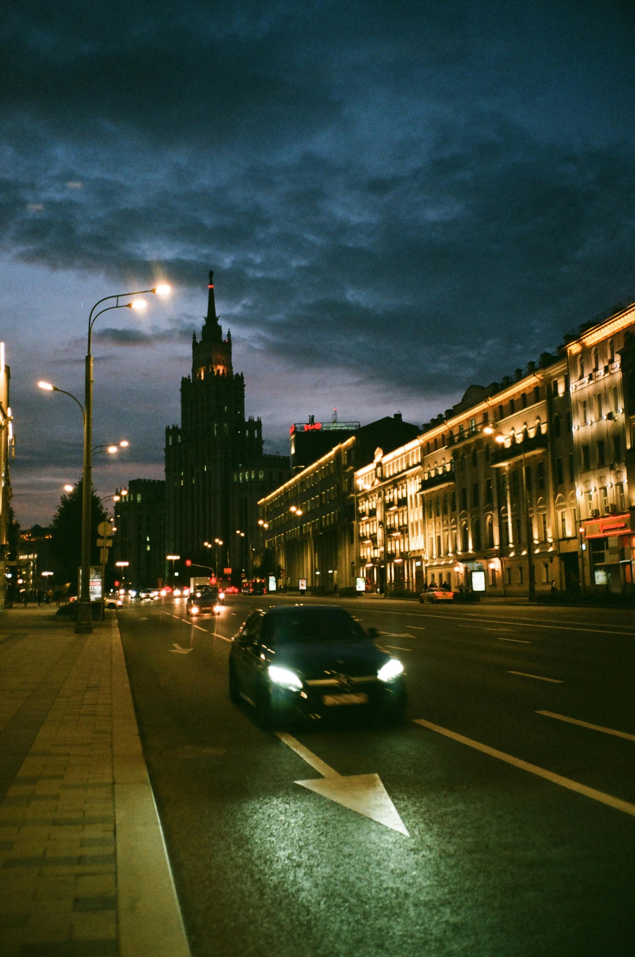 Bus driving on road at night · Free Stock Photo