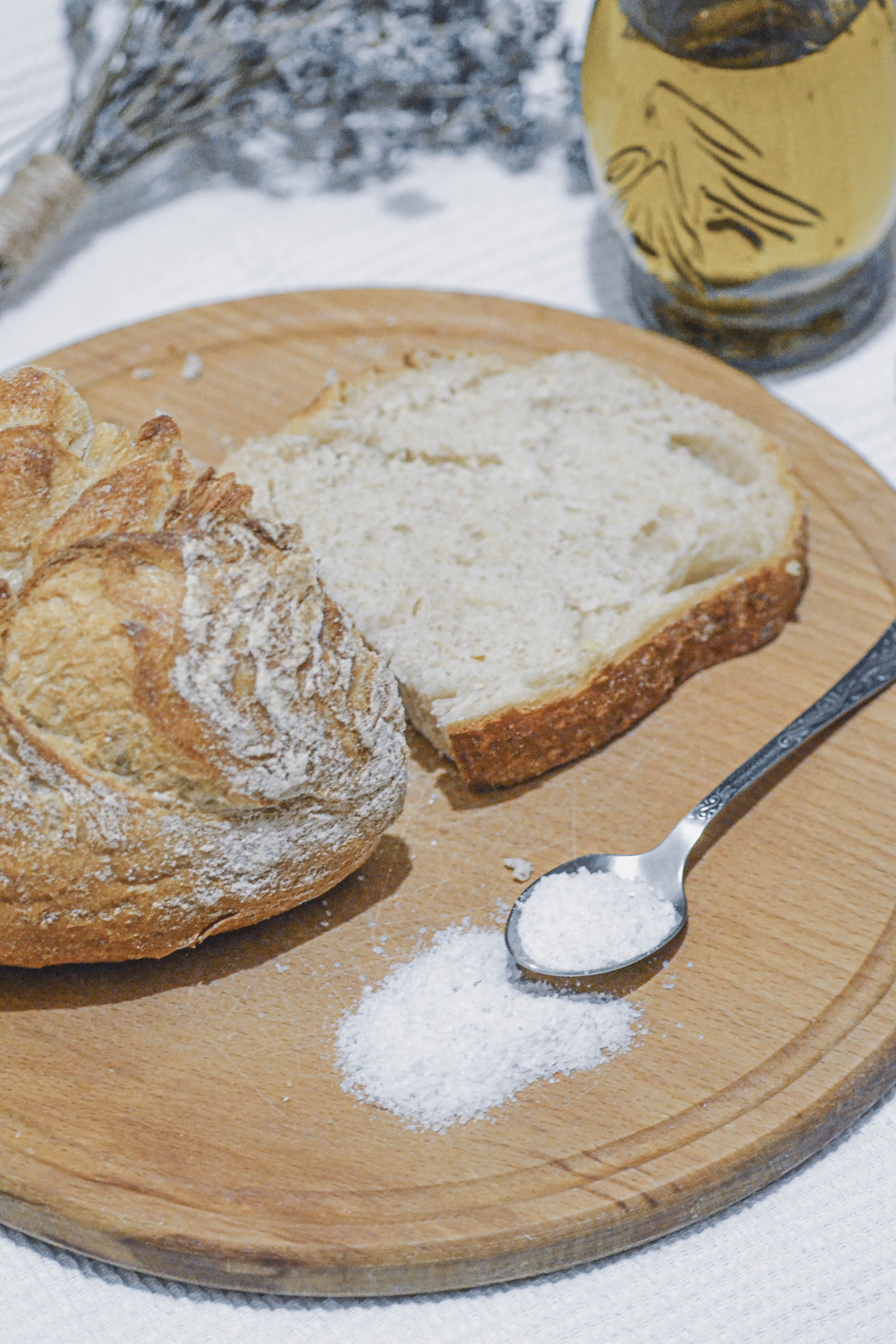 A Sliced Bread Loaf on a White Surface · Free Stock Photo