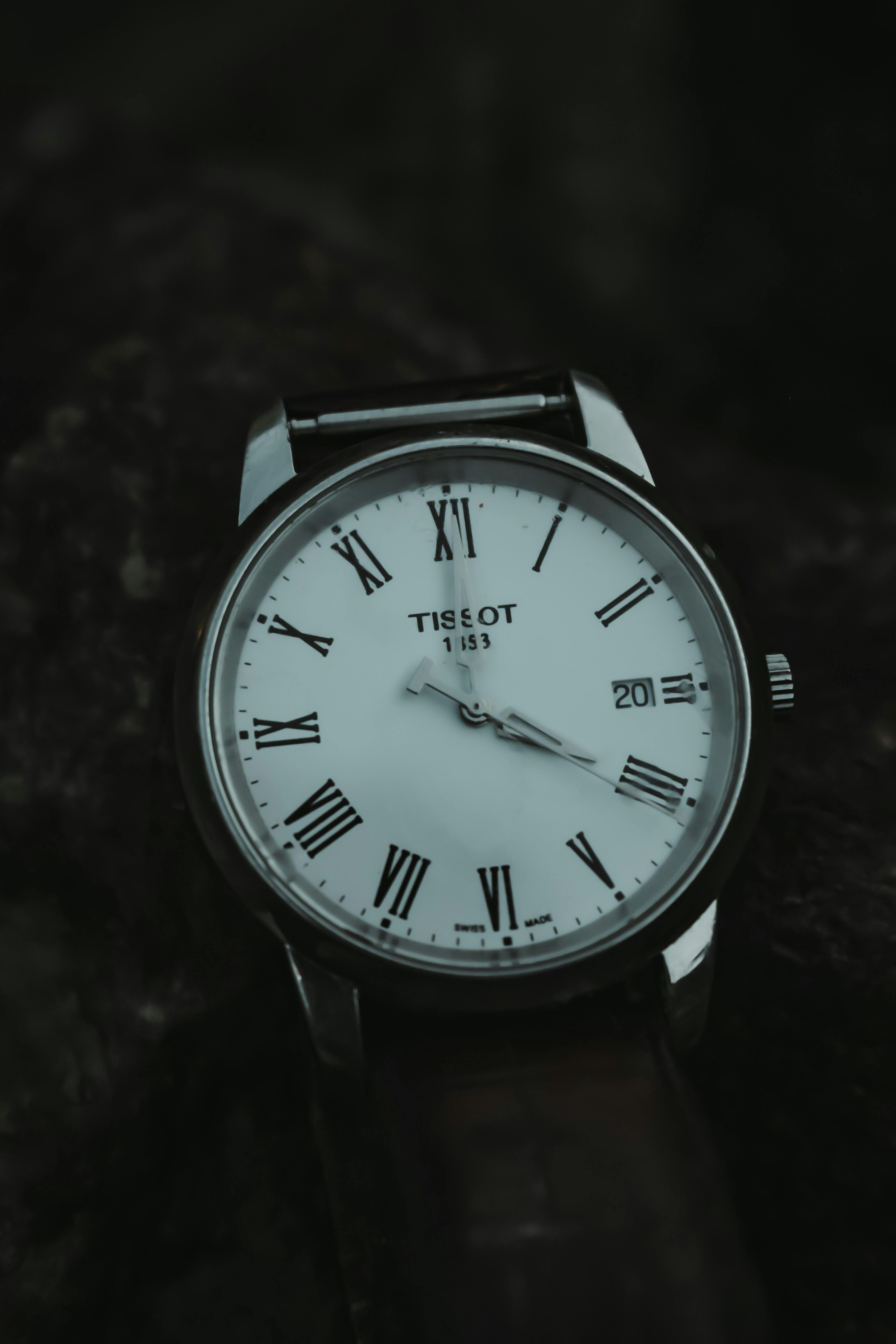 Black Watch on Black Glossy Surface · Free Stock Photo