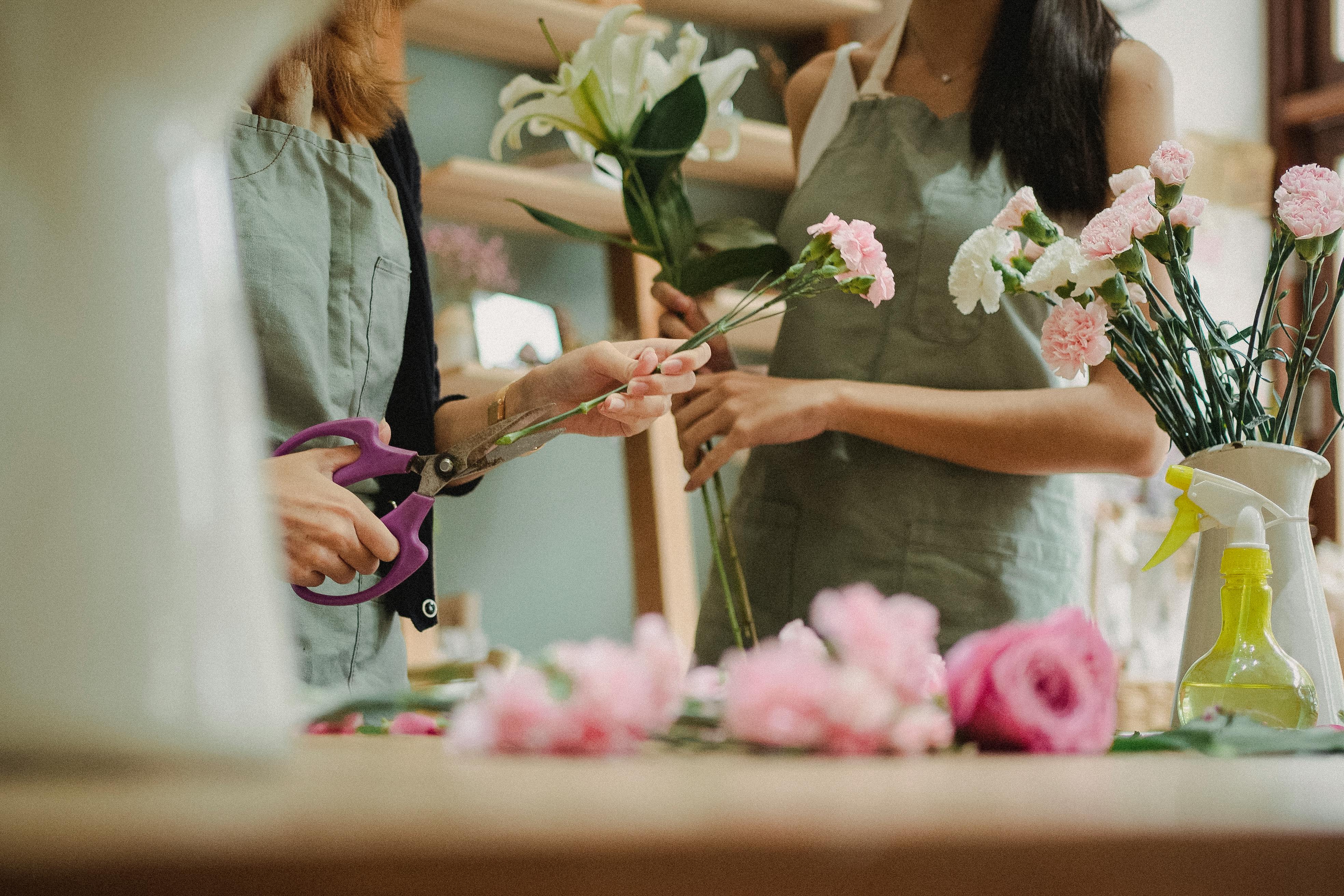 Crop women working with flowers in shop · Free Stock Photo
