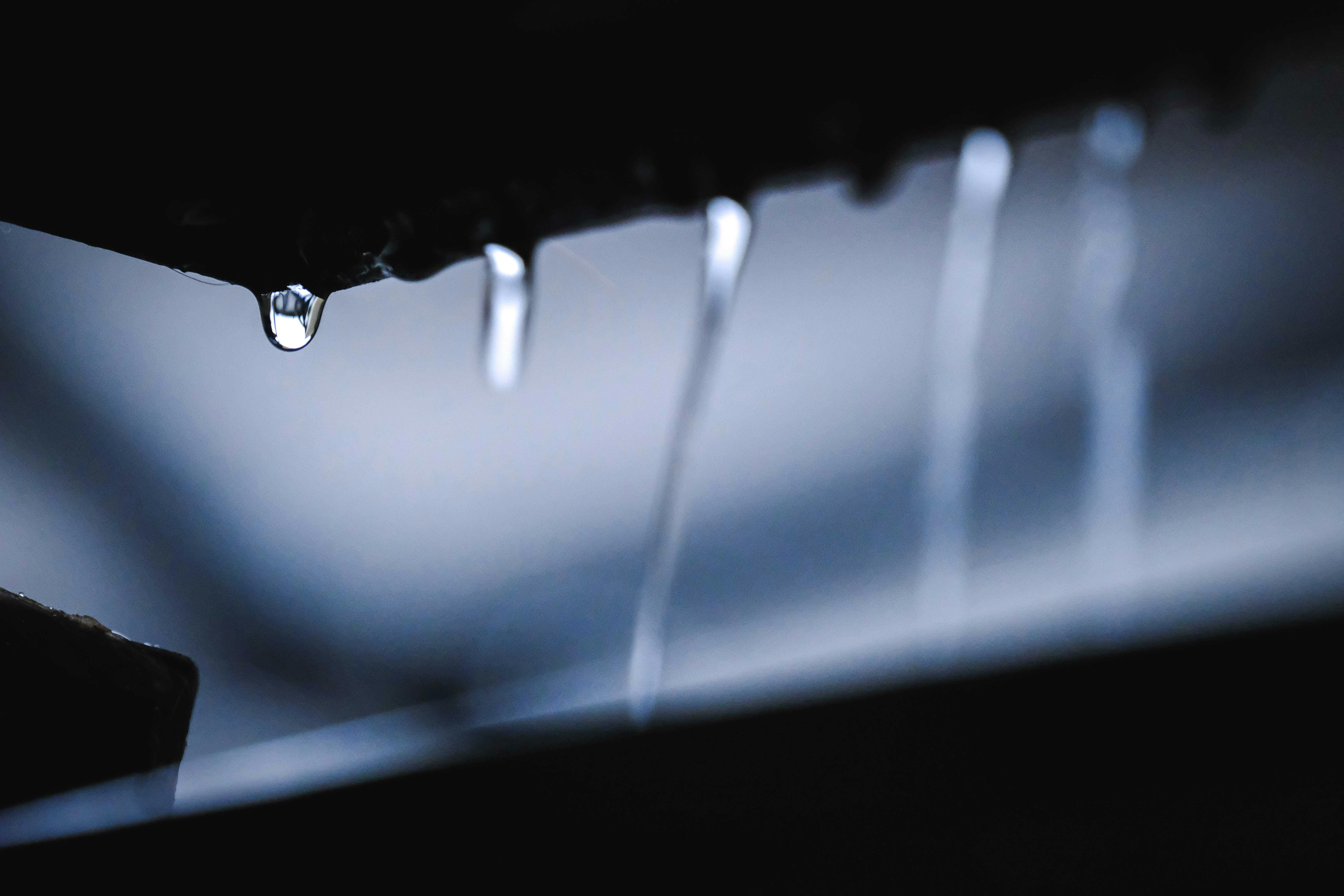 Rain flowing down from surface · Free Stock Photo