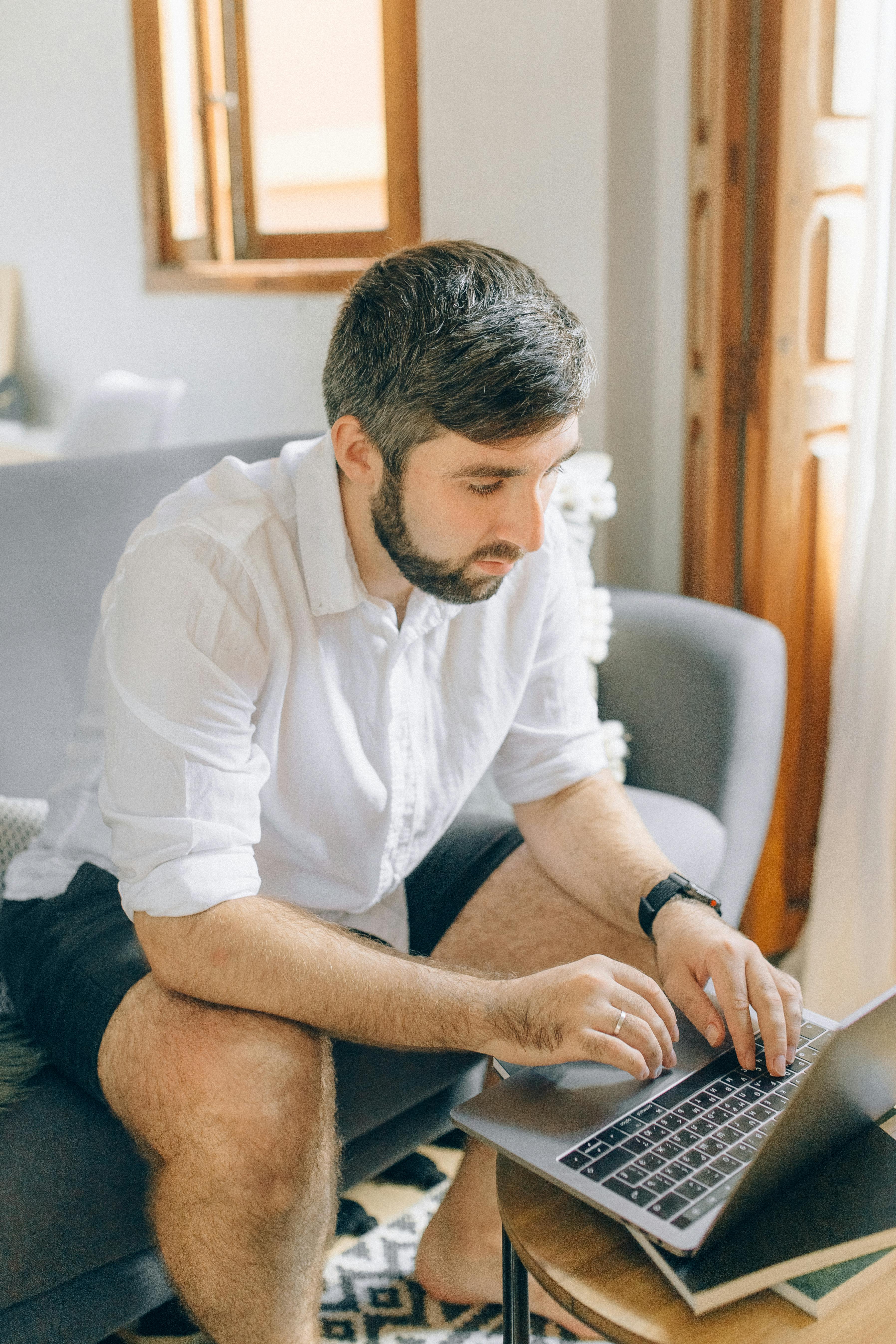 A Man Using a Laptop · Free Stock Photo