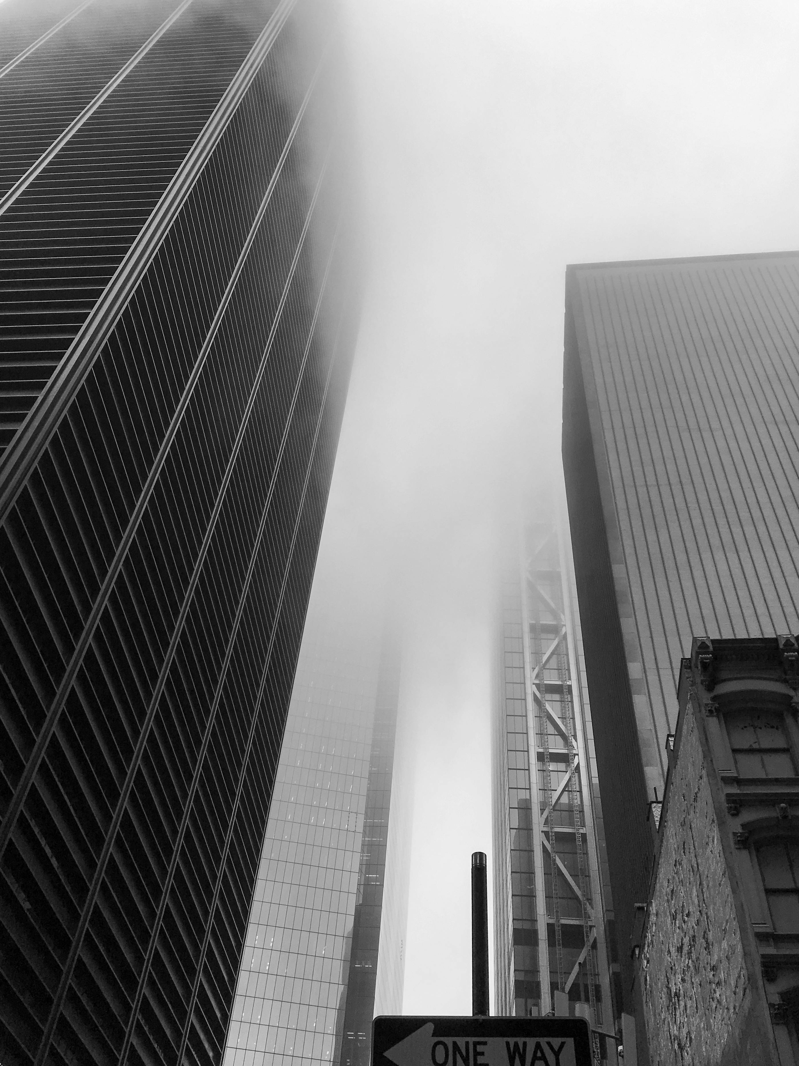 Low-angle Photography of Buildings Covered by Fog · Free Stock Photo