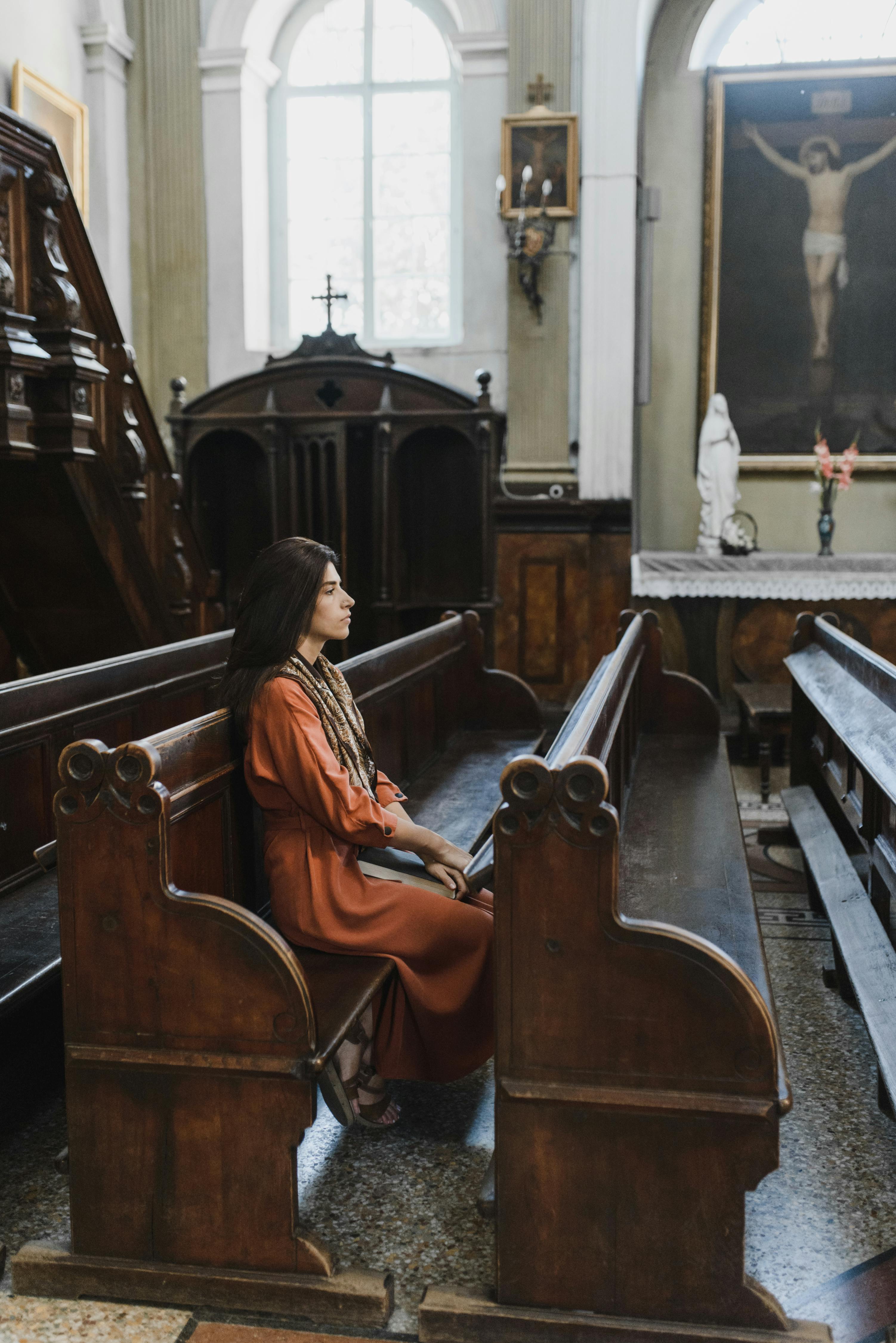 Woman Sitting in Church · Free Stock Photo