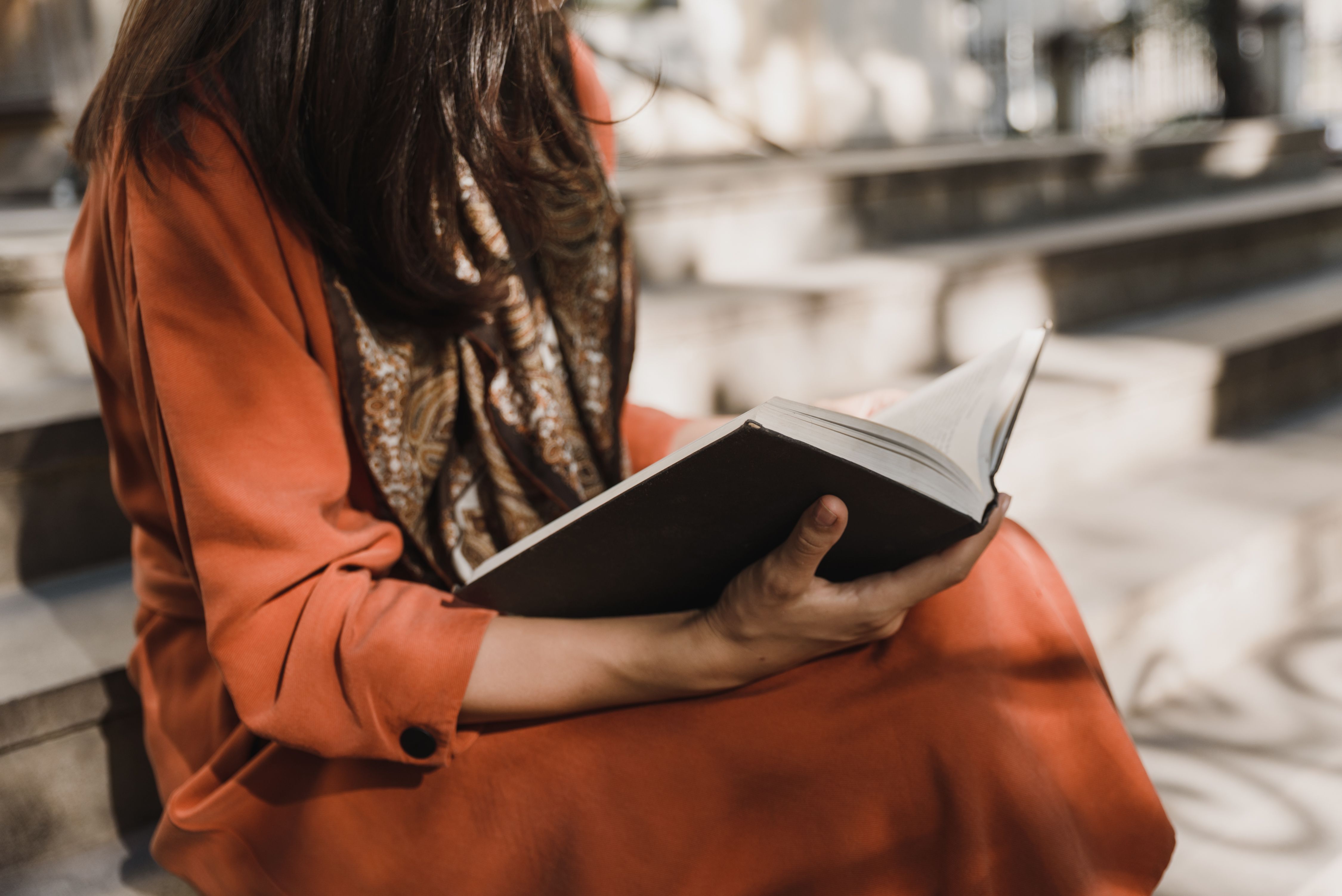 A Person Holding a Book · Free Stock Photo