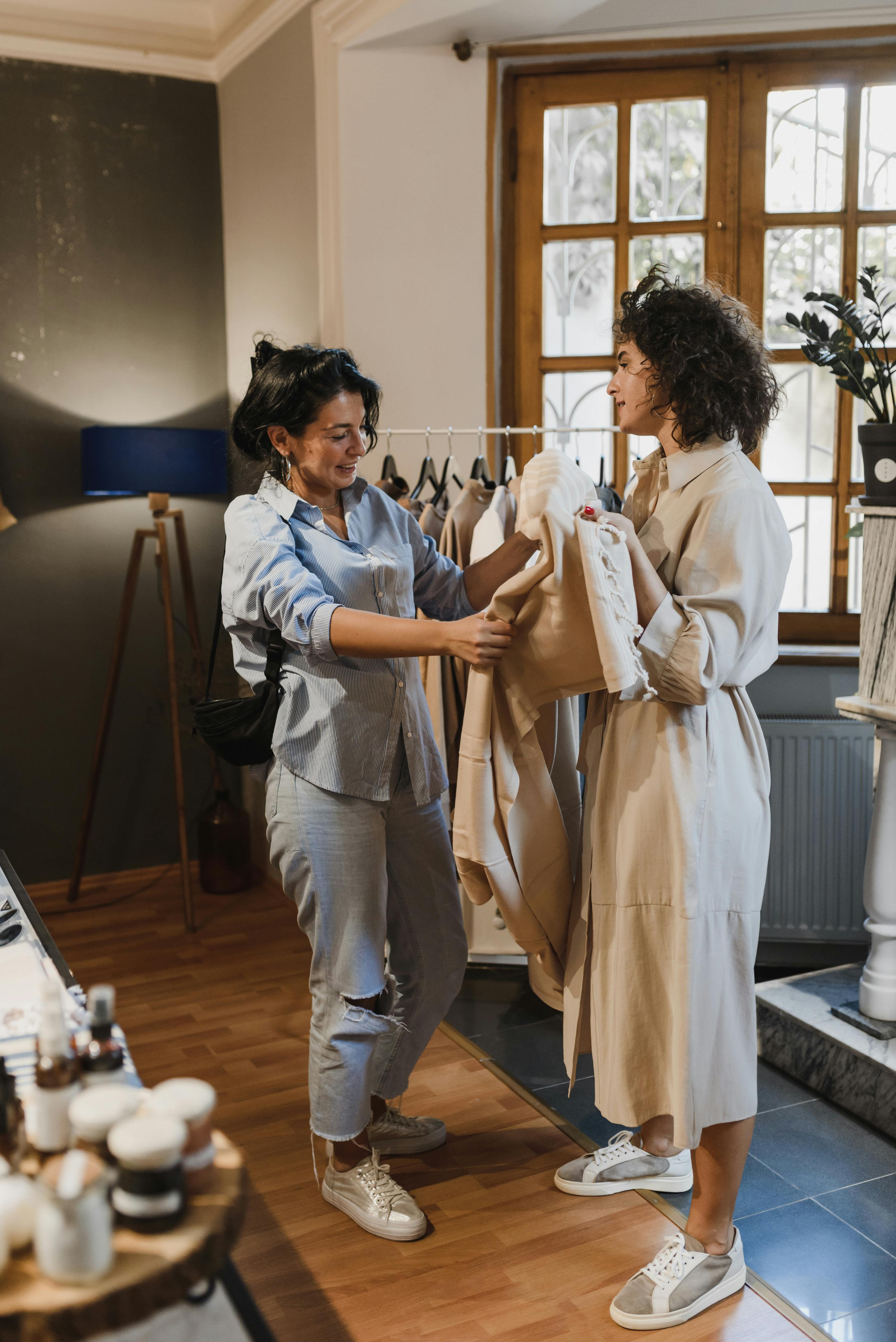 Women Picking out Clothes Together · Free Stock Photo