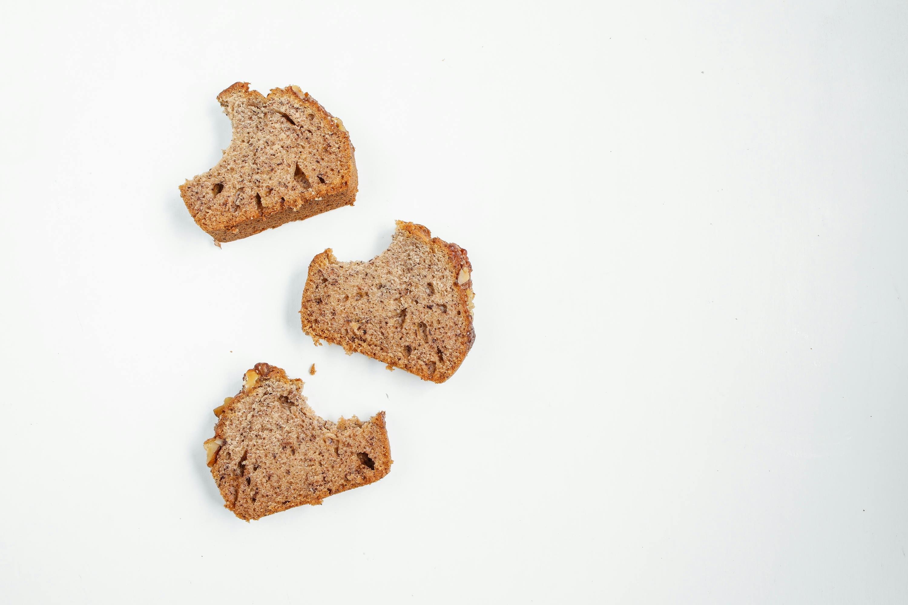 Bread Pieces on White Background · Free Stock Photo