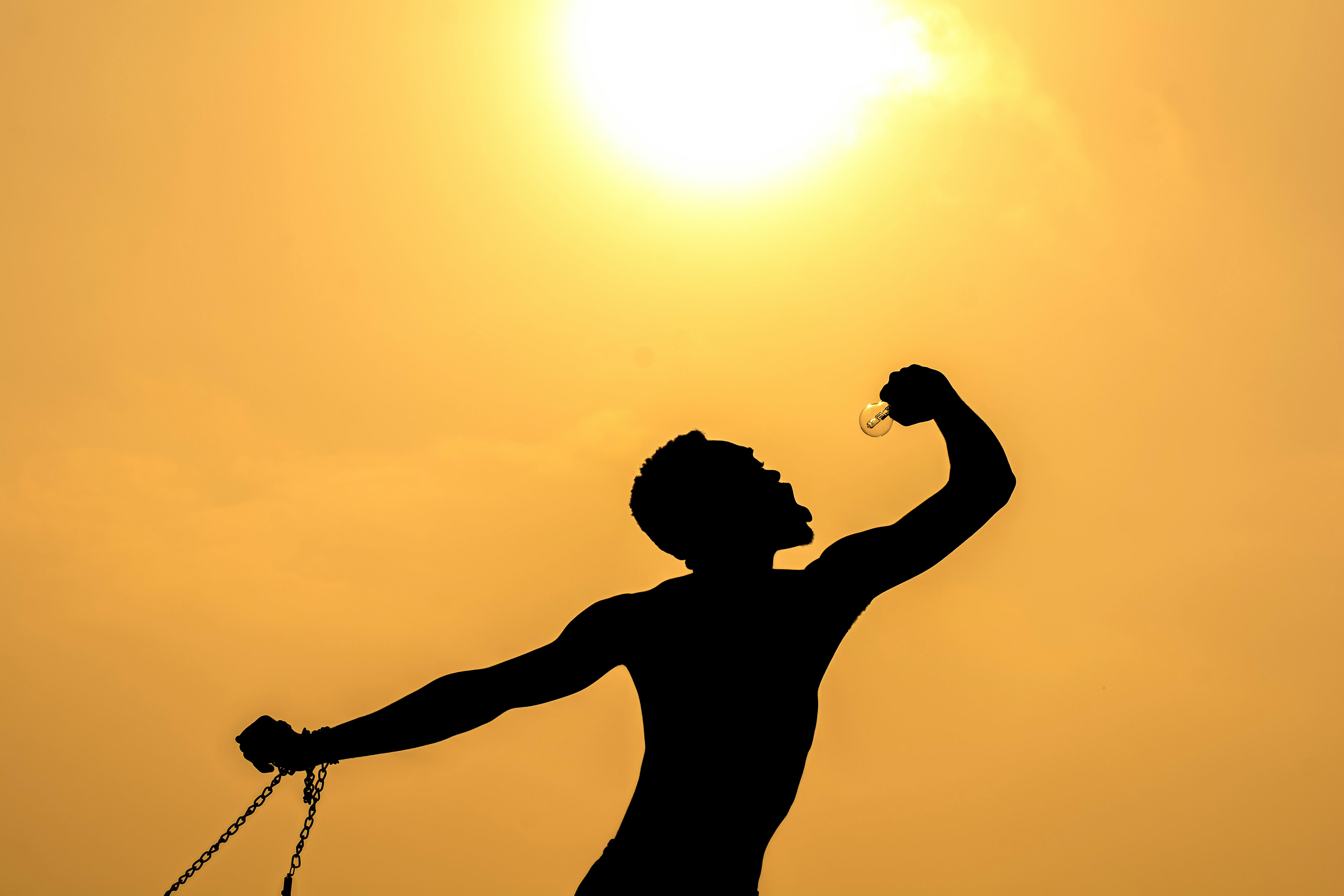 Black woman raising hand against skyline · Free Stock Photo