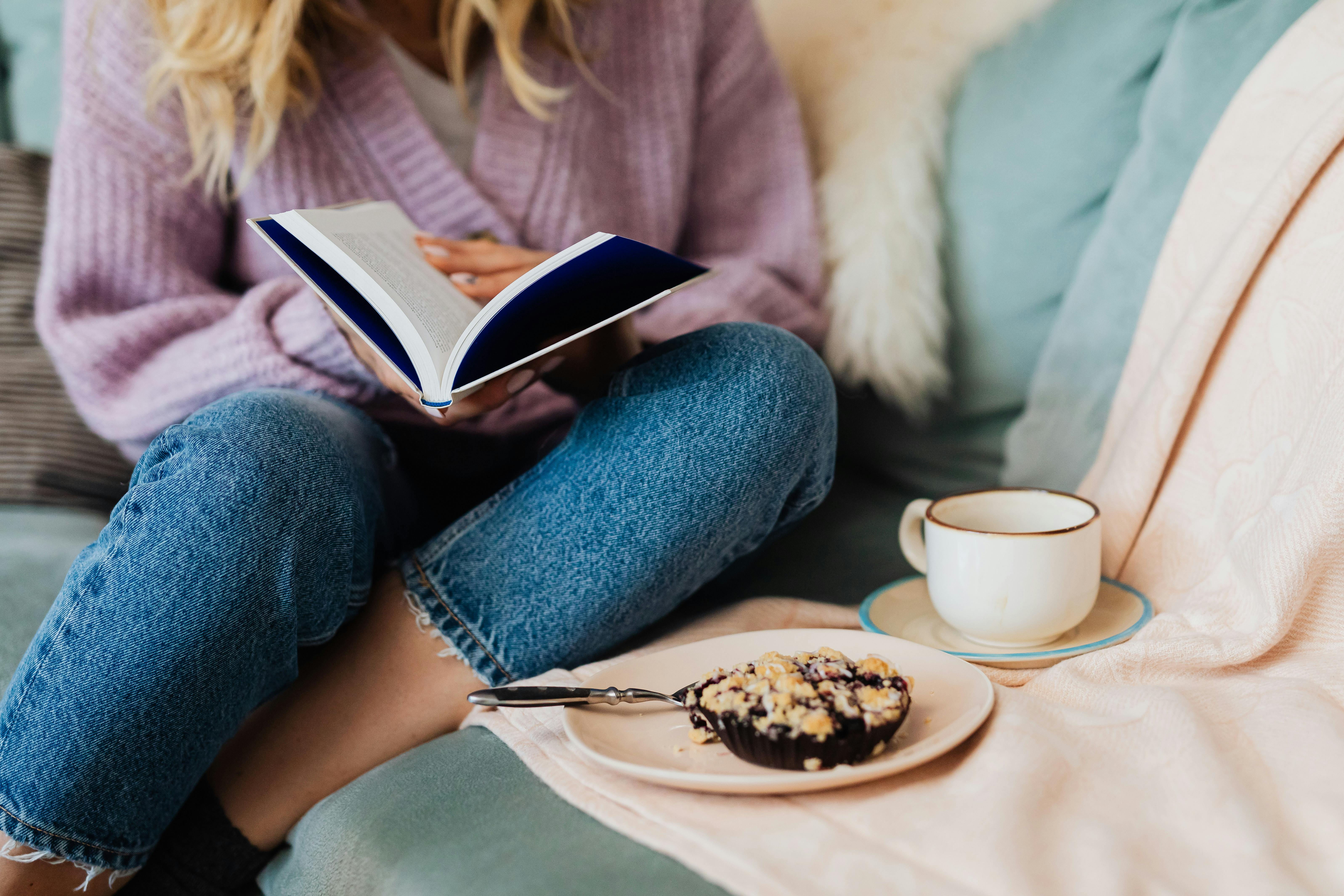 Close-Up Shot of Person Reading a Book · Free Stock Photo