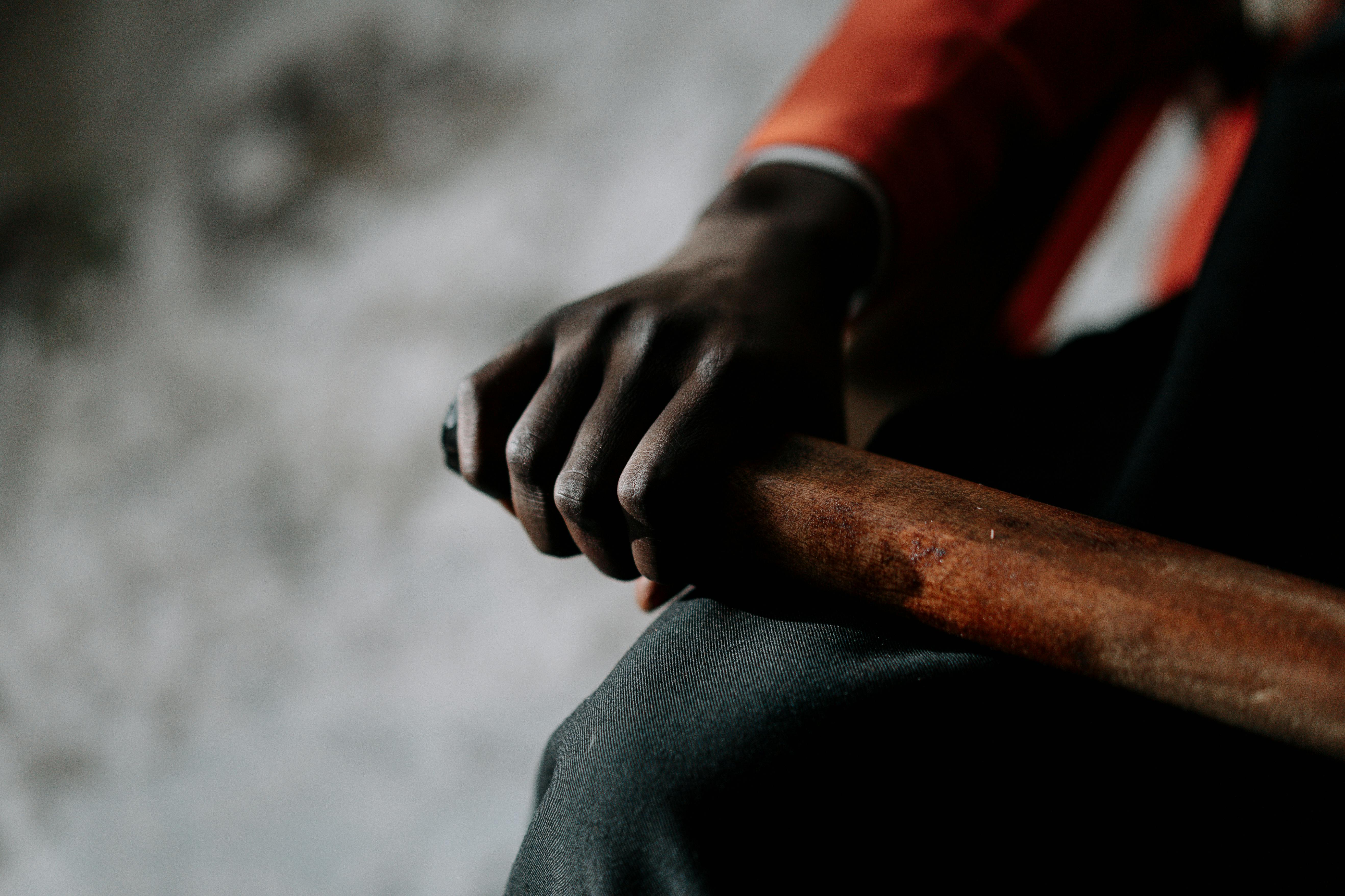 Person Holding Silver Pin on Left Hand · Free Stock Photo