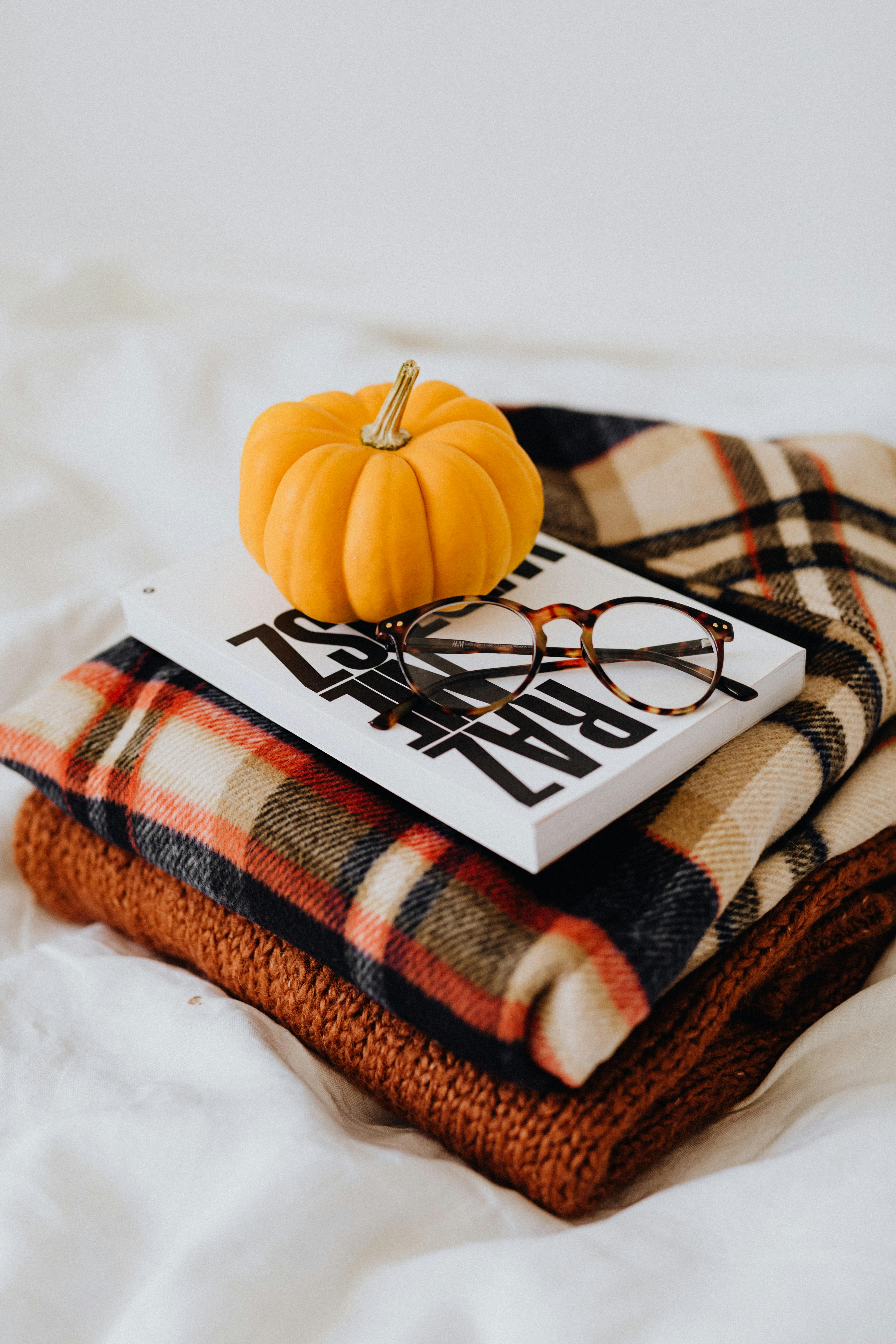 Pumpkin and a Spectacle on Top of Book · Free Stock Photo