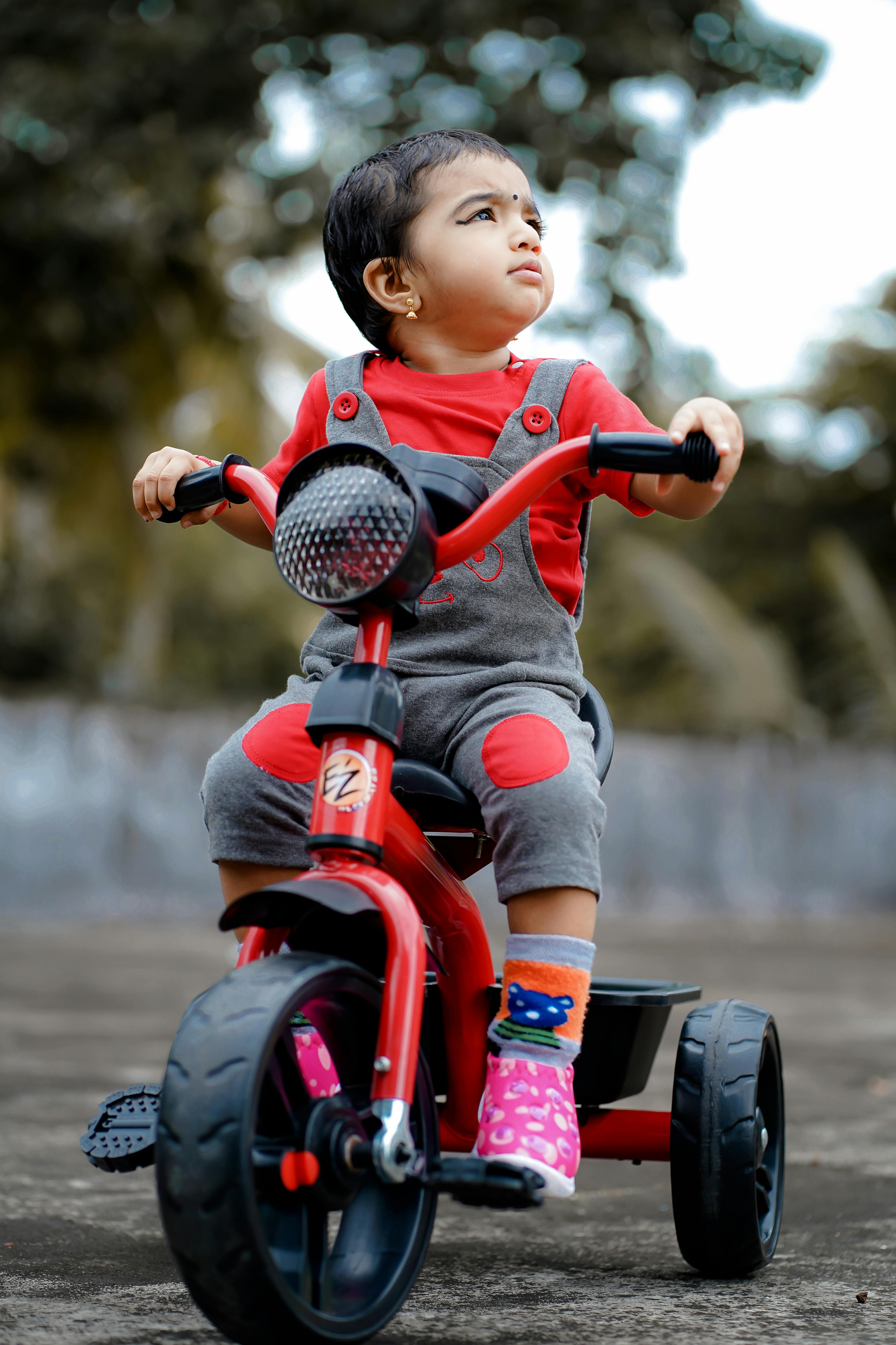 Child riding a Bike Toy · Free Stock Photo