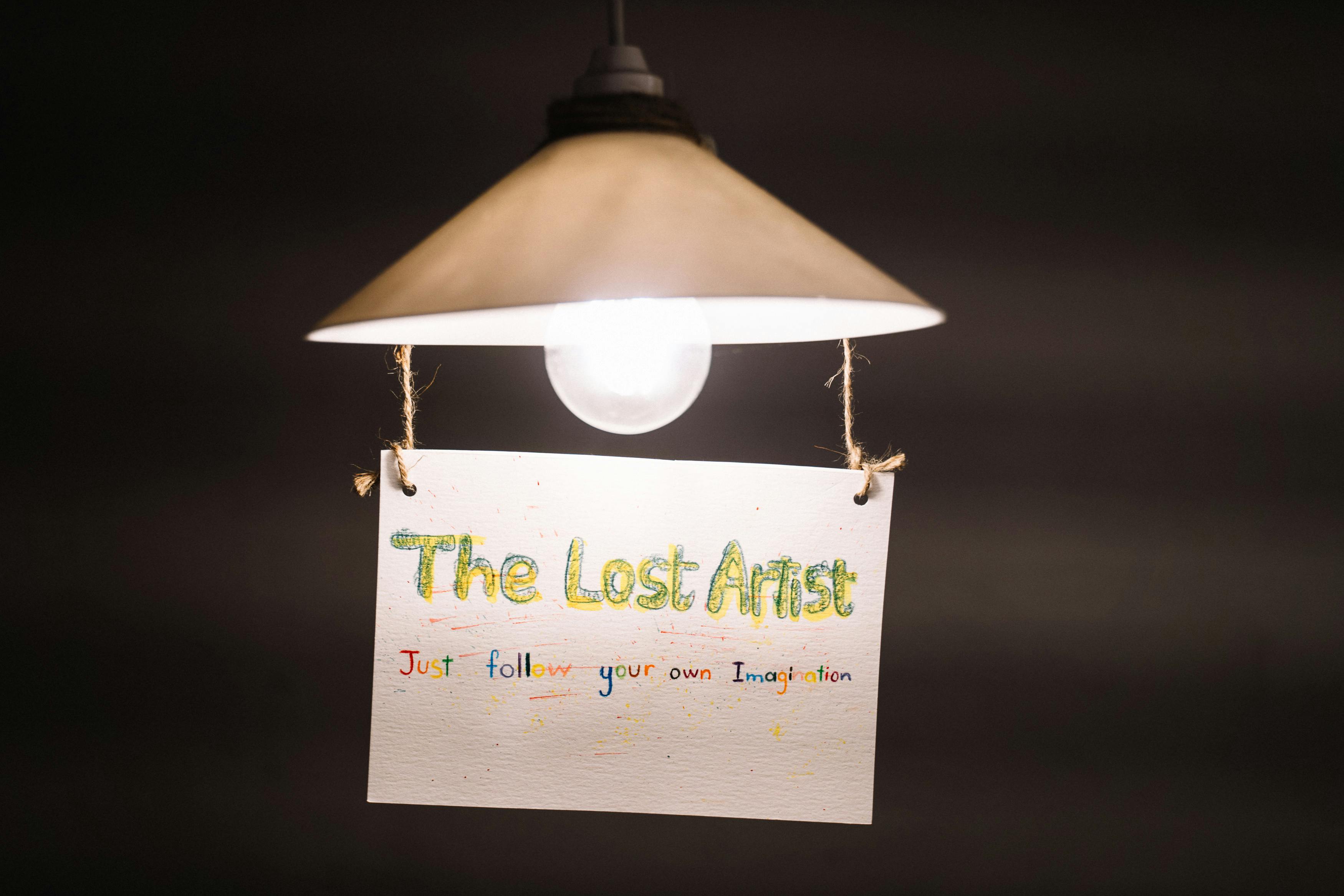 A Message Hanging on a Light Bulb · Free Stock Photo