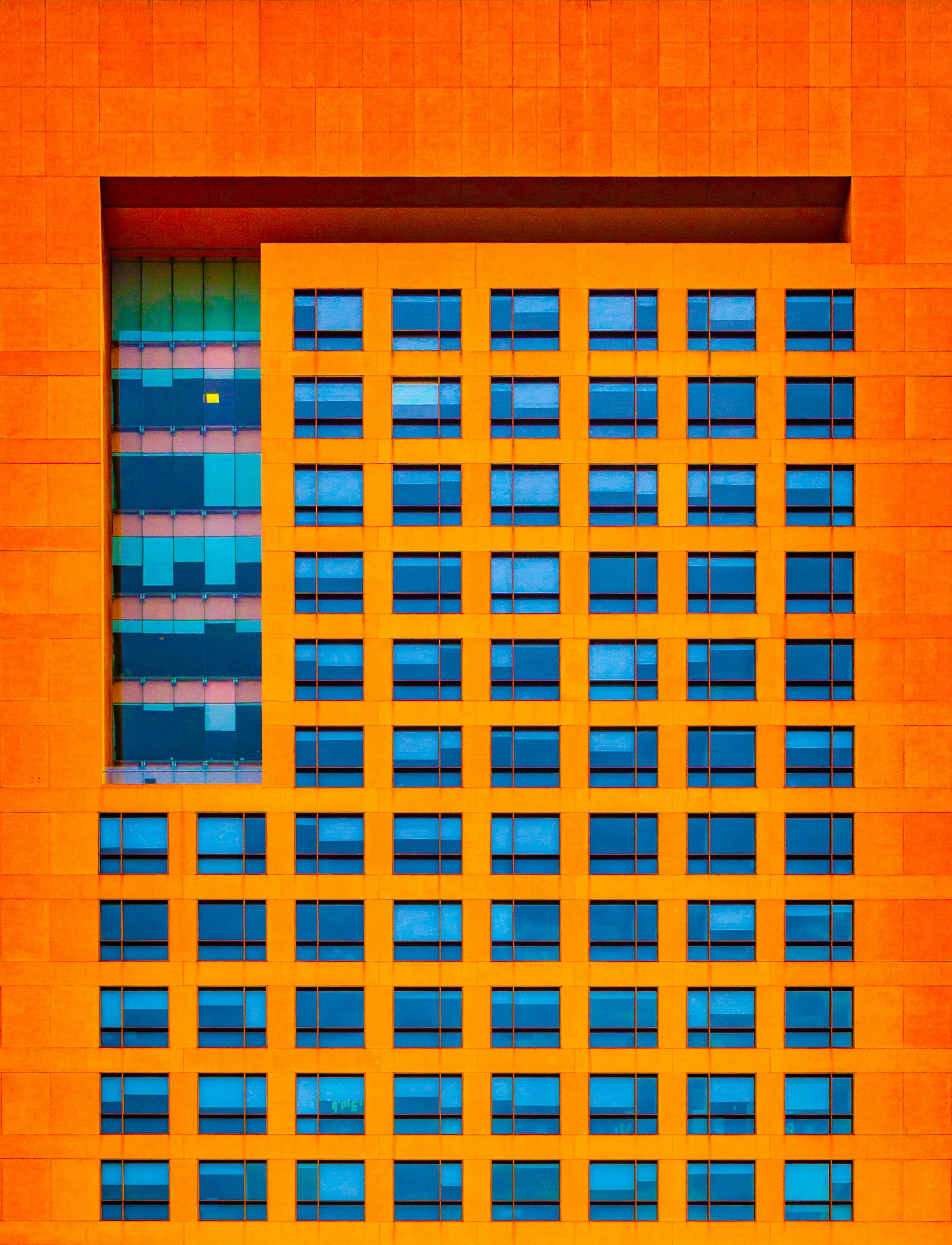 Colorful building exterior with windows · Free Stock Photo