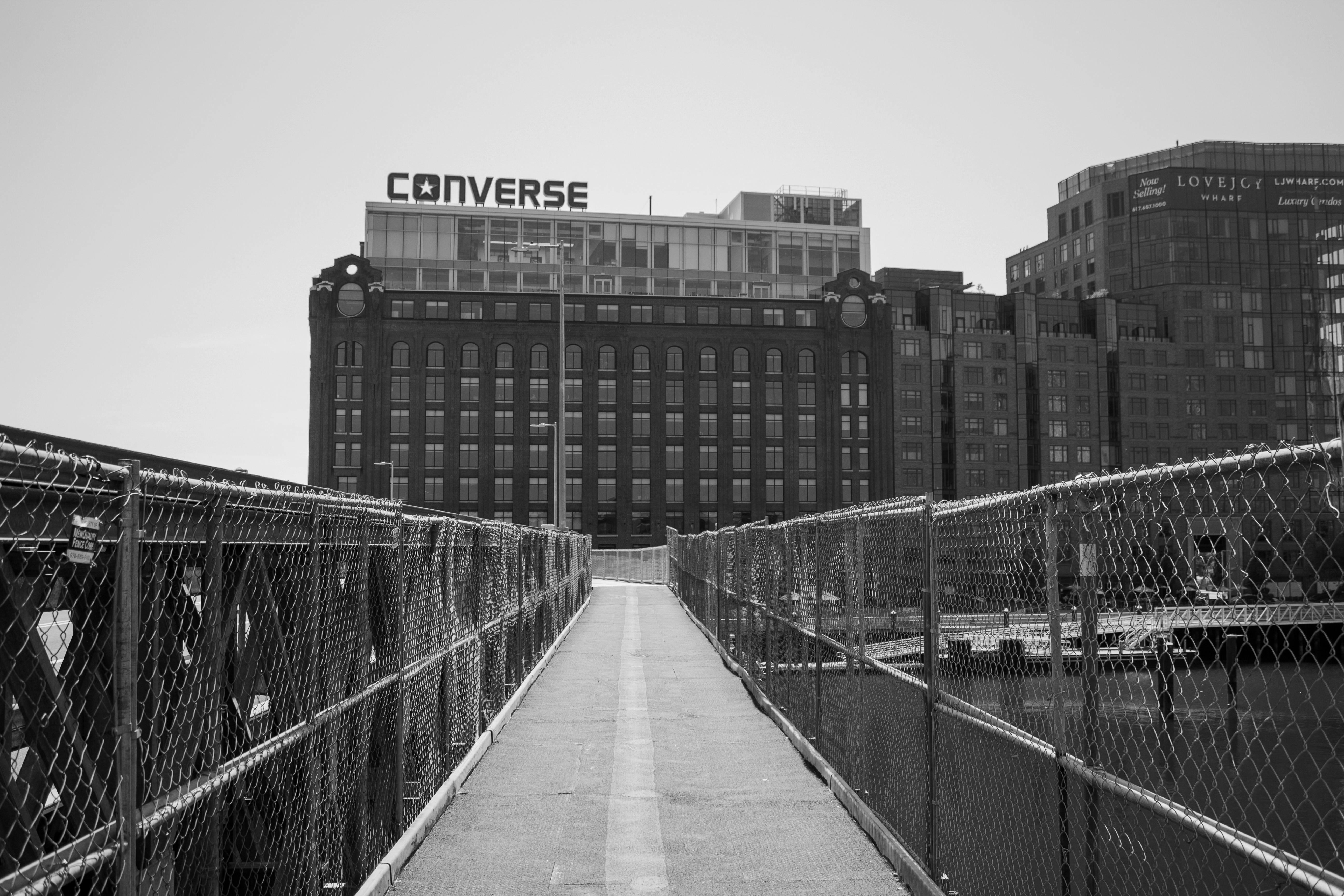 Brown Concrete Building Near Bridge · Free Stock Photo