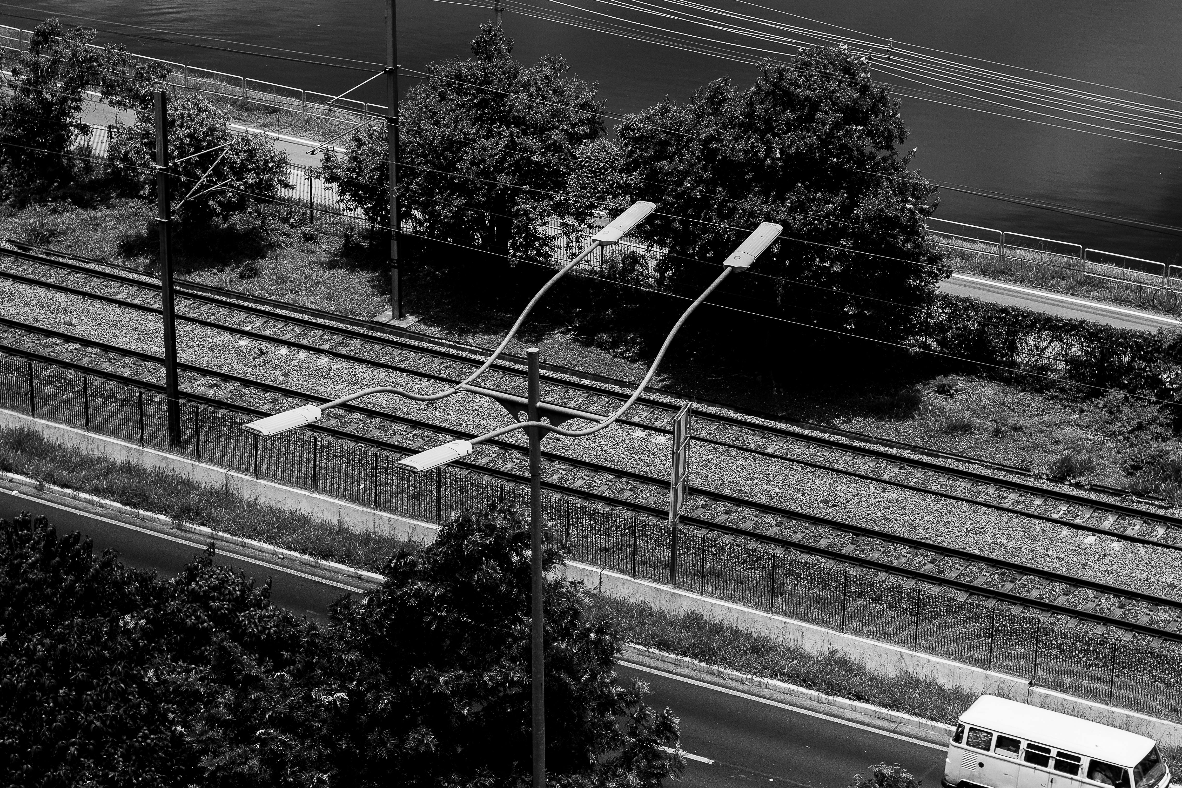 Grayscale Photo of Train Rail · Free Stock Photo